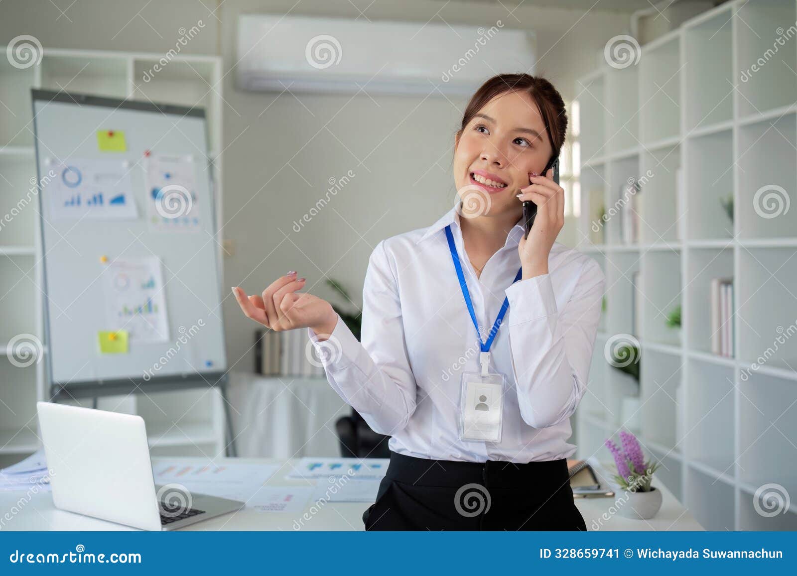 Young Accountant Using Telephone while Working on Paperwork in Modern ...