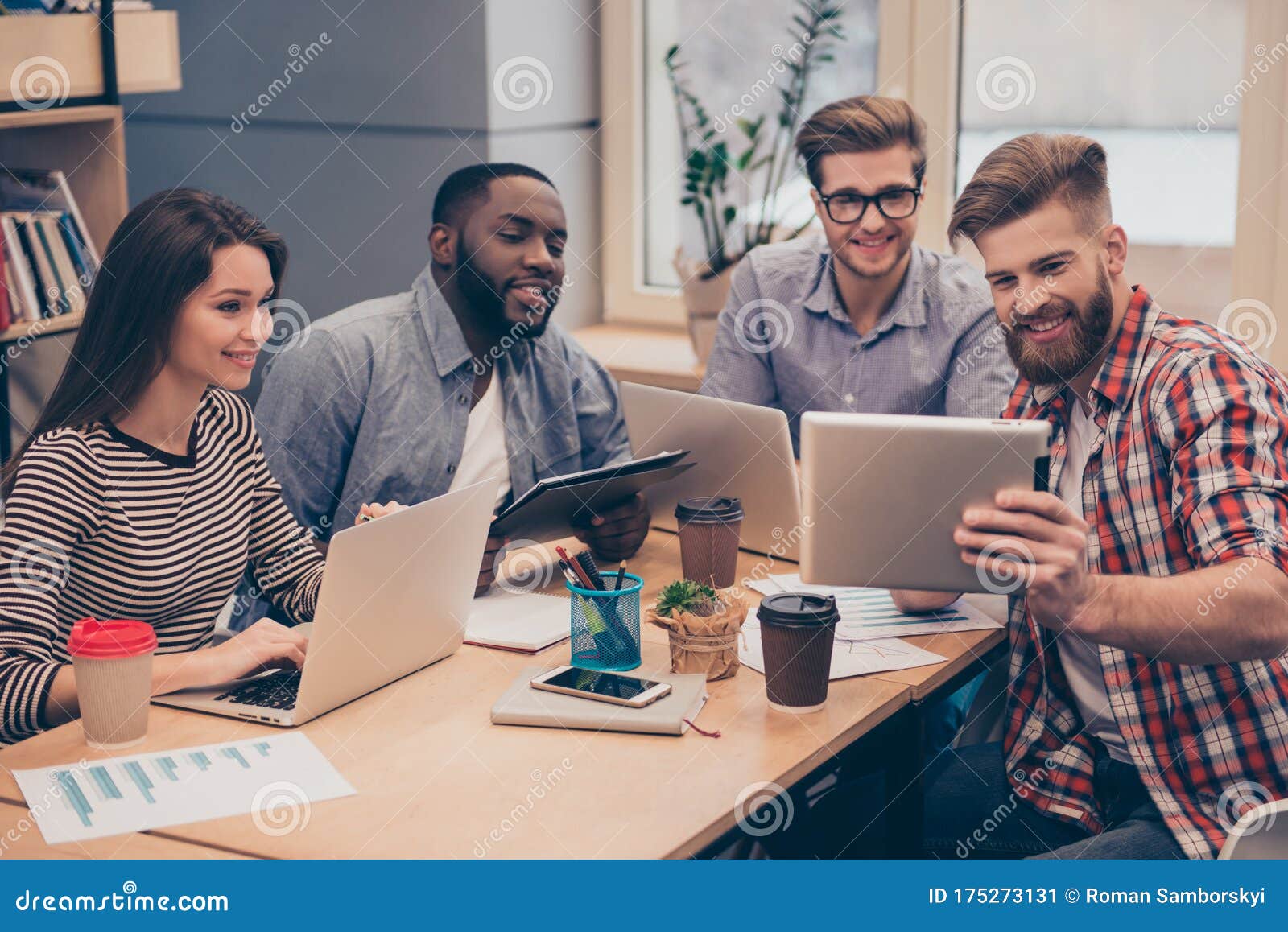 Young Active Diverse Team Working with a Business Project Stock Image ...