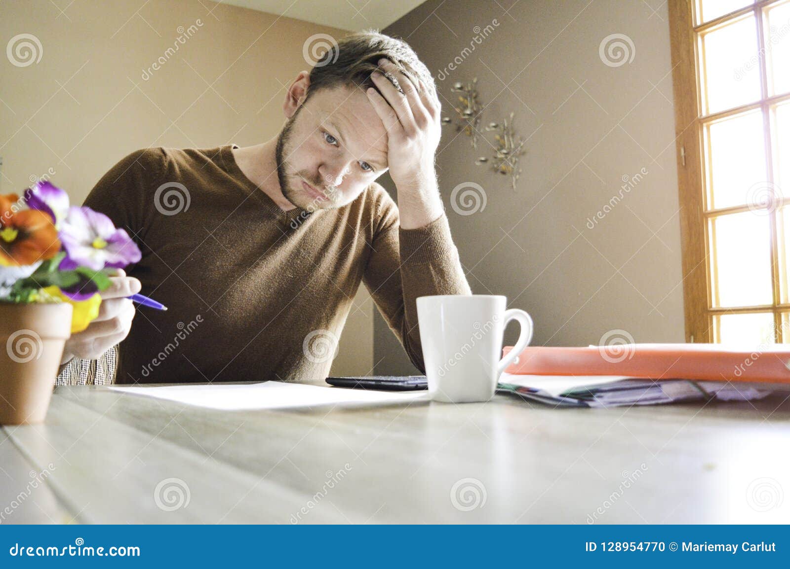 Young Active Man Holding His Head Working Paperwork at the Desk Stock ...