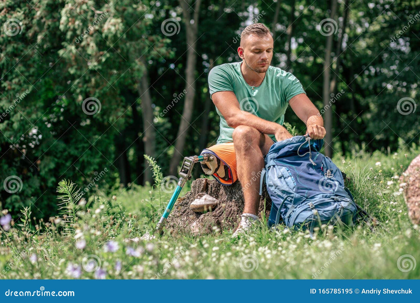 Young Active Man with Prosthesis Sitting on the Tree Stump Stock Image ...
