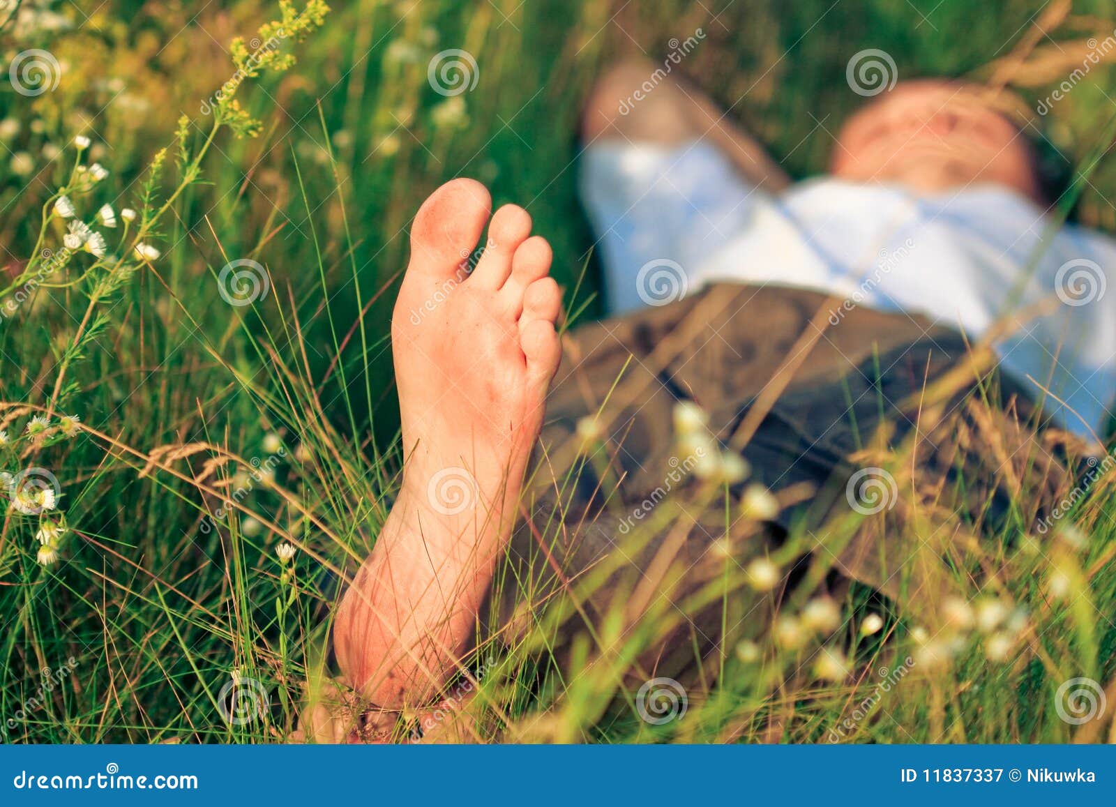 Young Adult Man in Spring Grass Stock Image - Image of sleep, meadow ...