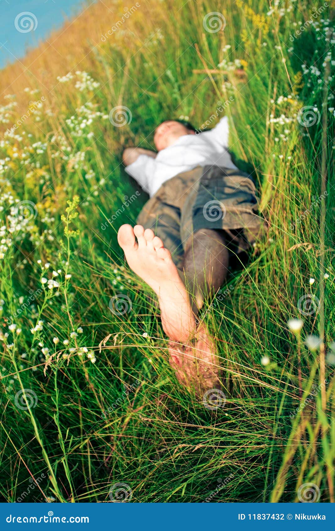 Young Adult Man in Spring Grass Stock Photo - Image of park, close ...
