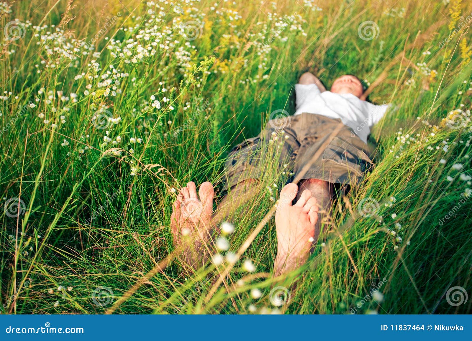 Young Adult Man in Spring Grass Stock Photo - Image of relax, outdoor ...
