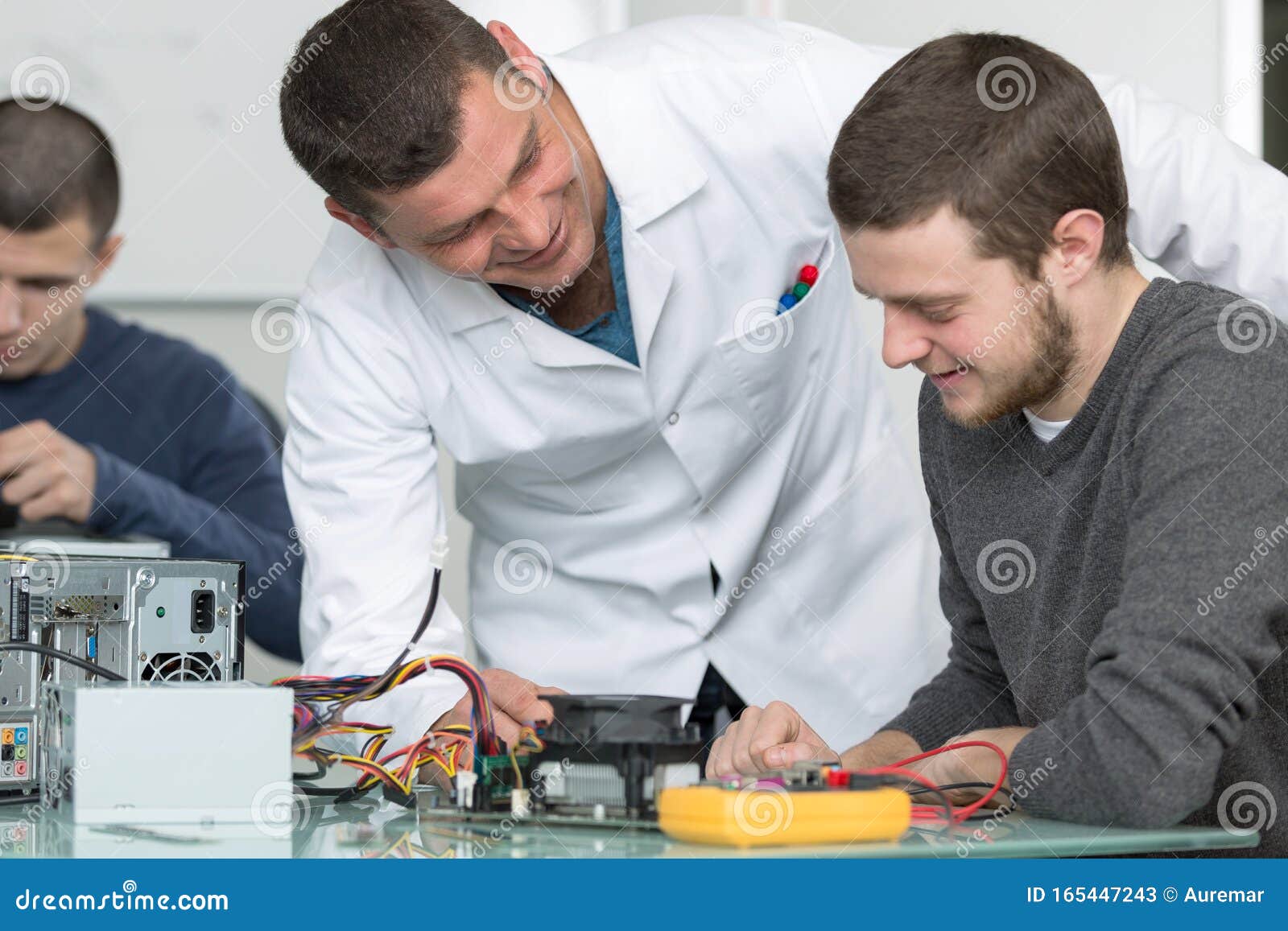 Young Adults Fixing Computer Hardware in Technology School Stock Image ...