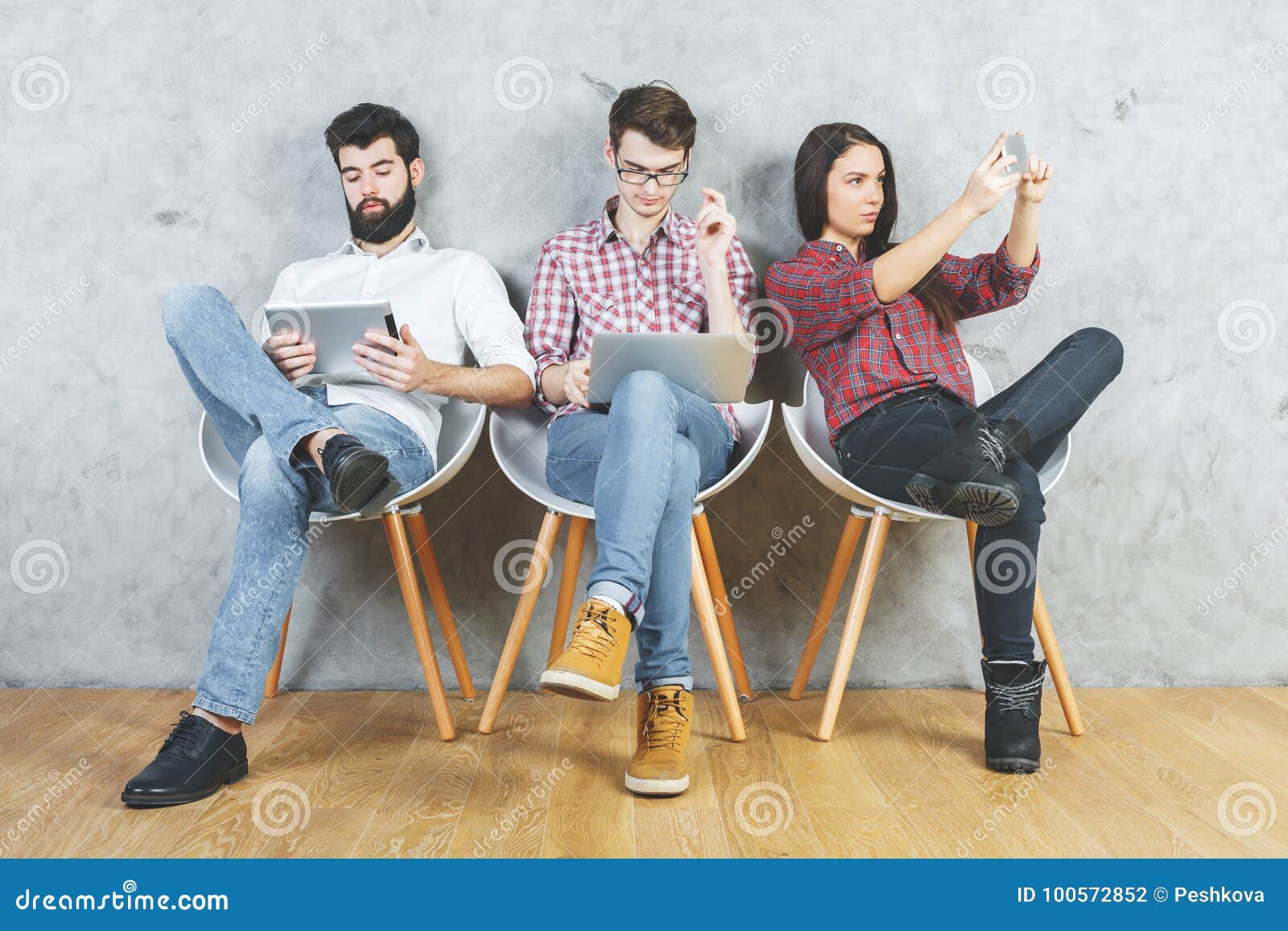 Young Adults Using Electronic Gadgets Stock Photo - Image of electronic ...