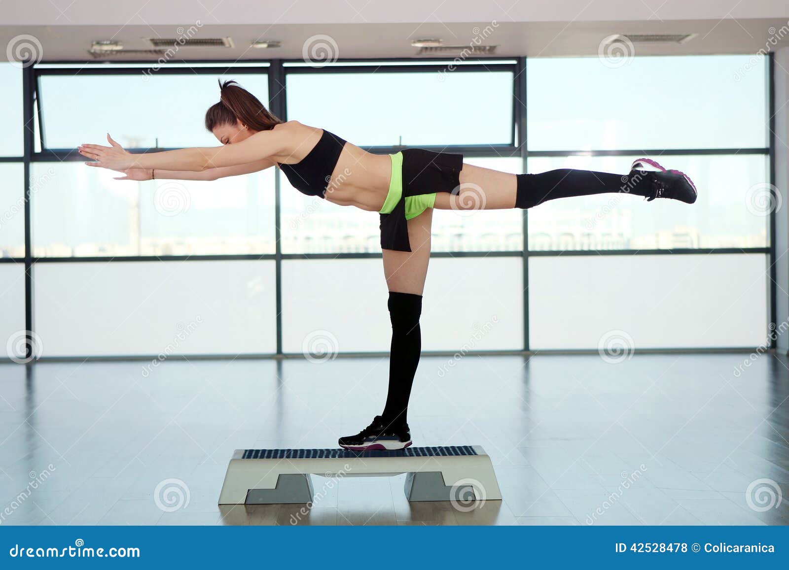 Young aerobics doing steps stock photo. Image of stepper - 42528478
