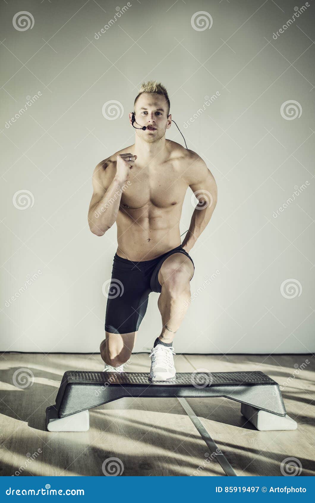 Young Aerobics Male Coach on Step Teaching Class Stock Image - Image of ...