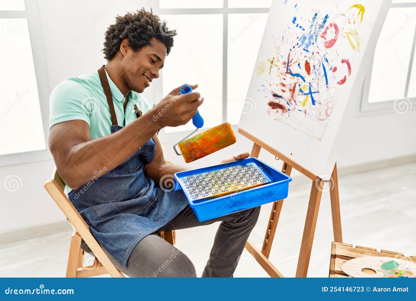 Young African American Artist Man Drawing Using Paint Roller at Art ...