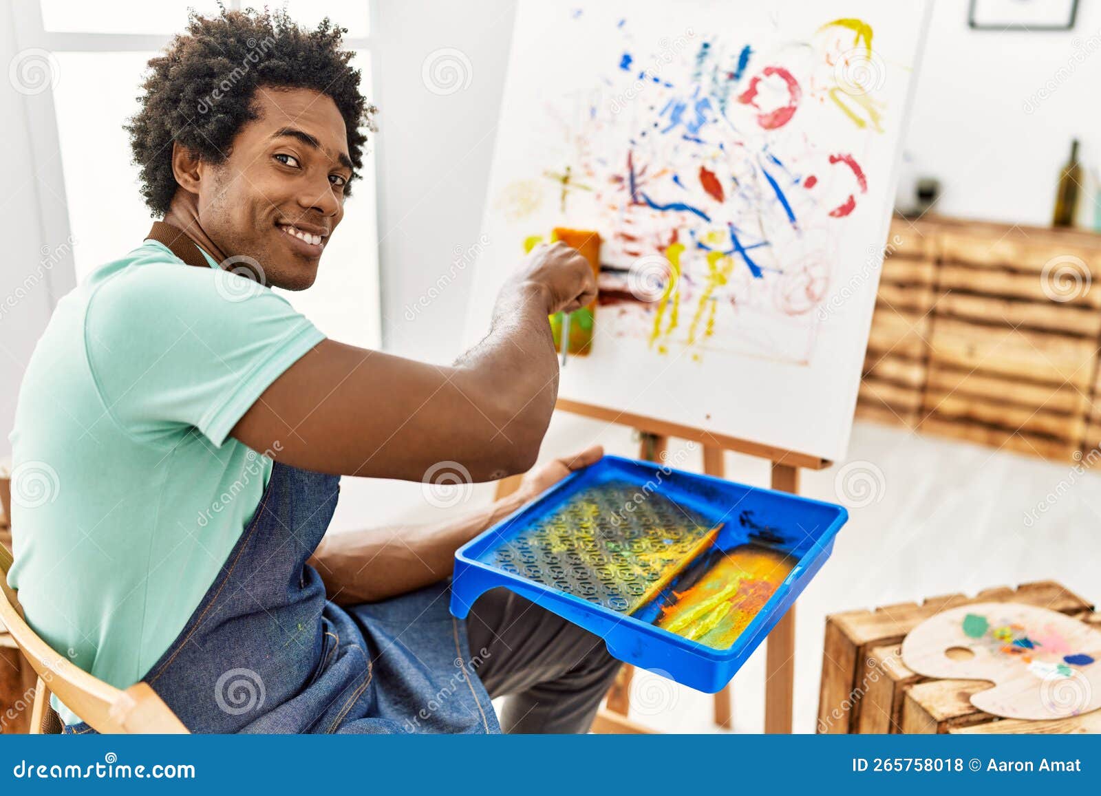 Young African American Artist Man Drawing Using Paint Roller at Art ...