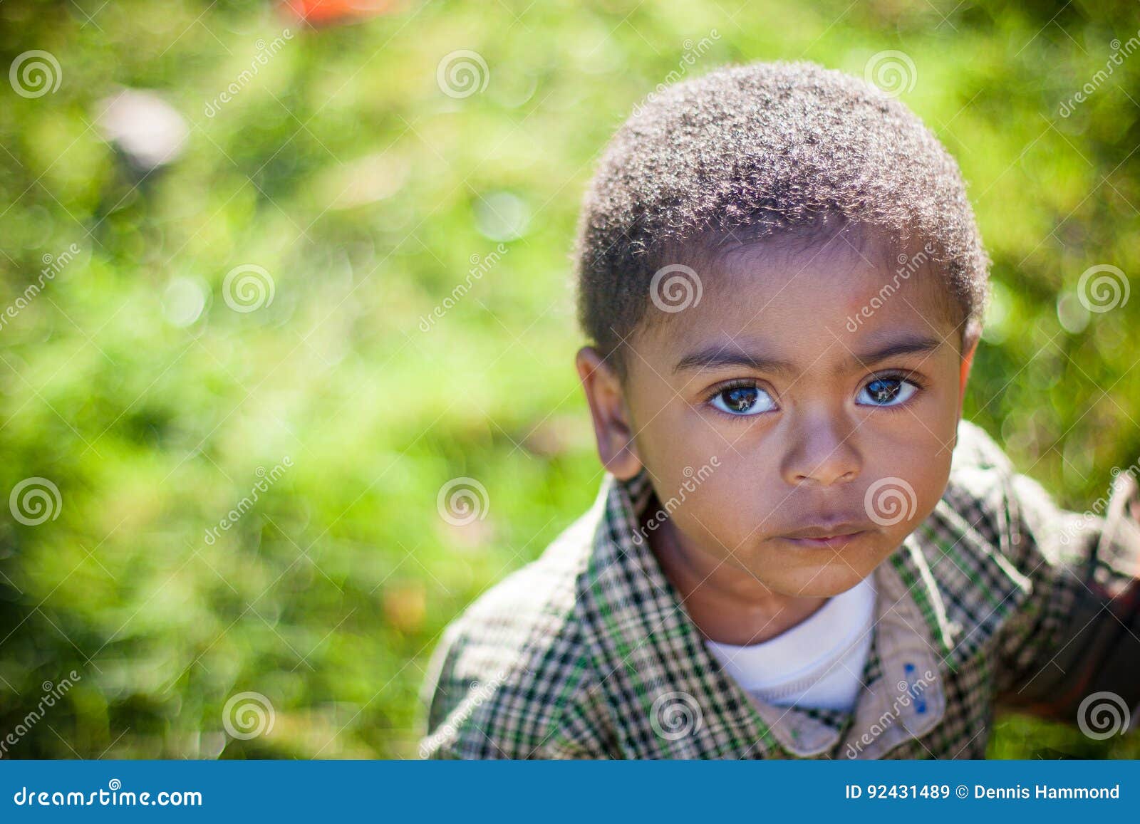 Young African American Boy Looking Up at Camera Stock Image - Image of ...