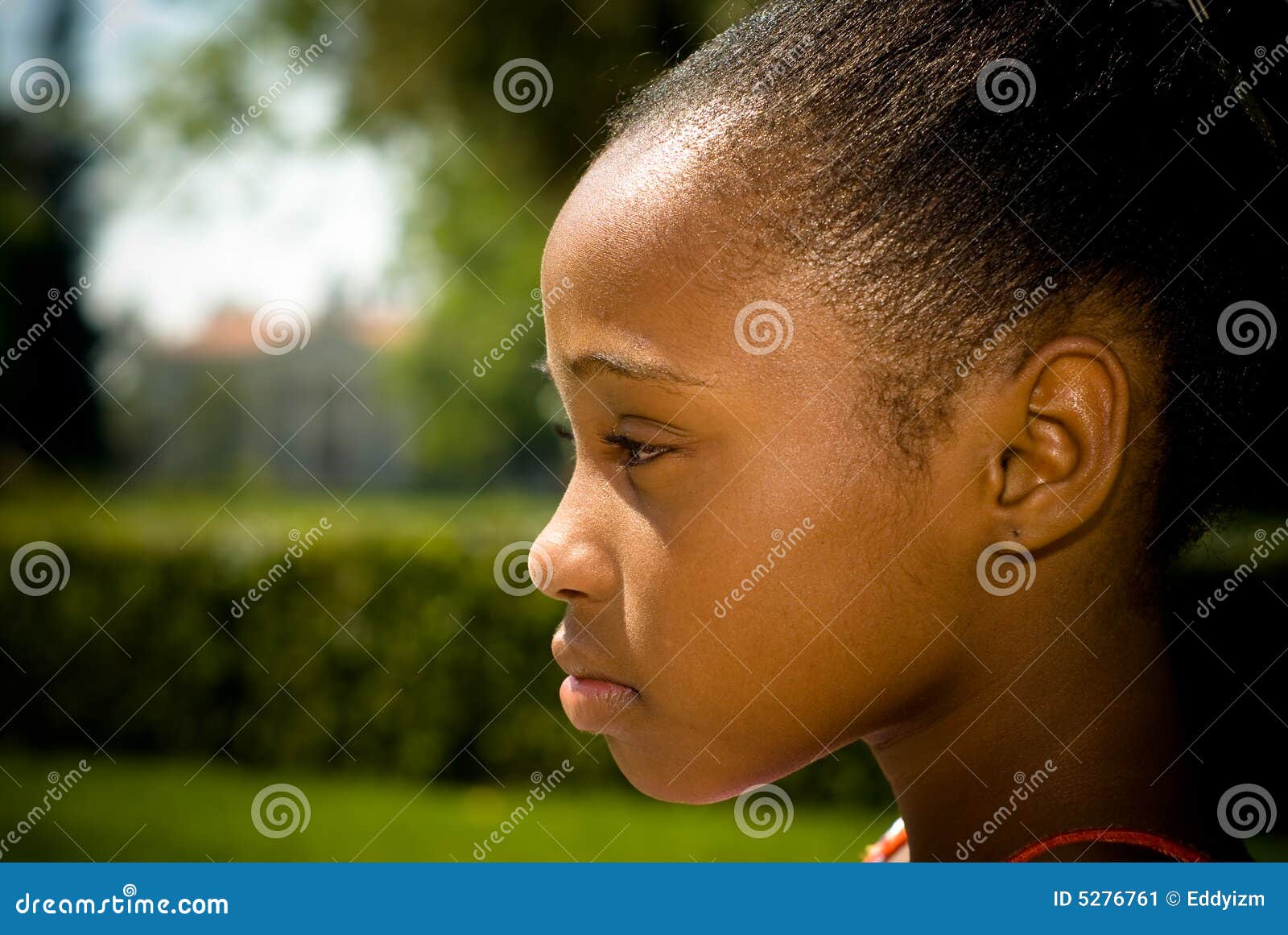 African Boy In Profile On A White Background Looks Straight Ahead Stock ...