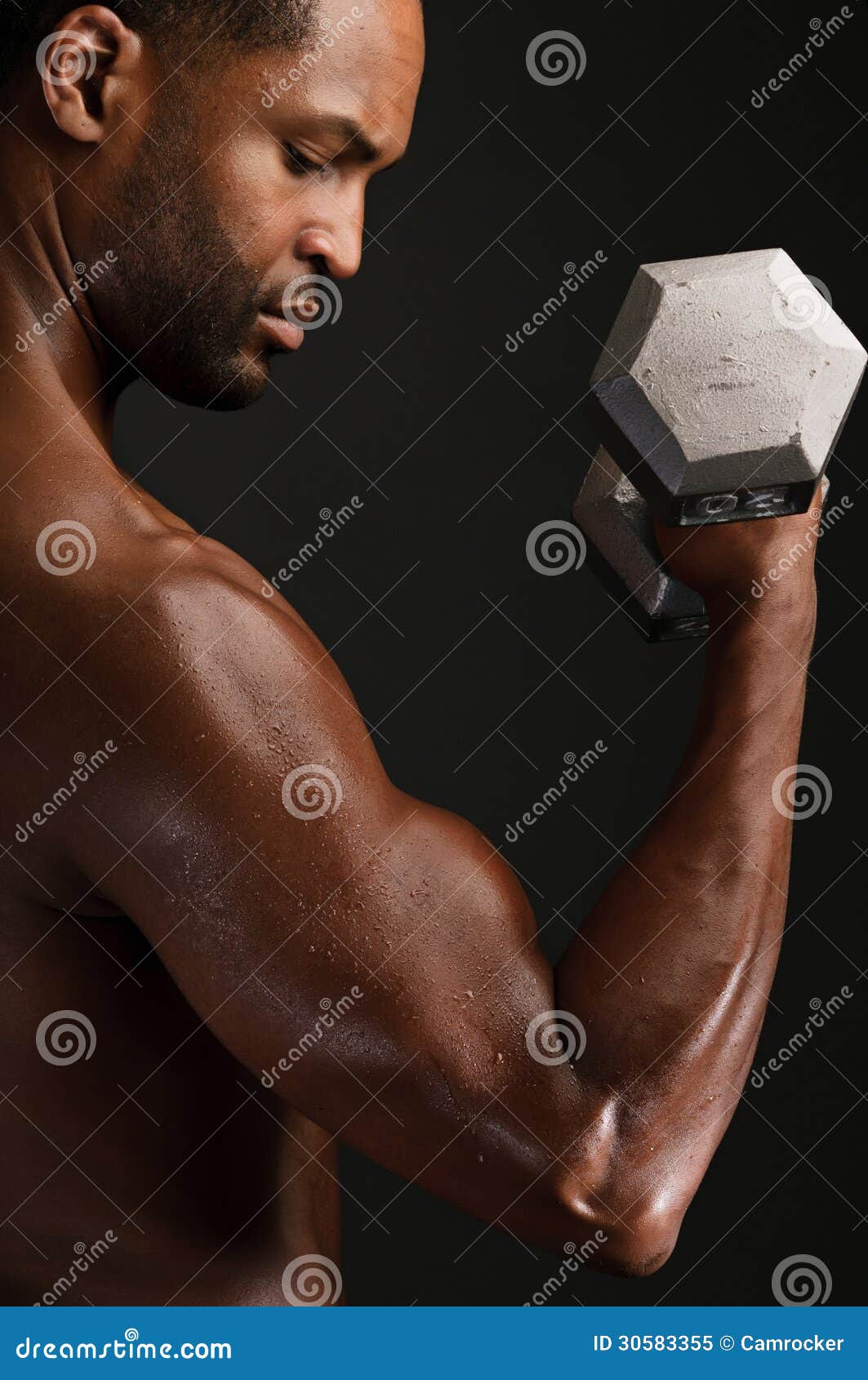 African Man Flexing His Biceps And Looking On It Royalty-Free Stock ...