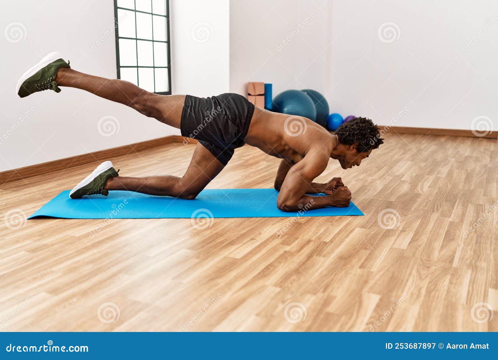 Young African American Man Training Abs Exercise at Gym Stock Image ...