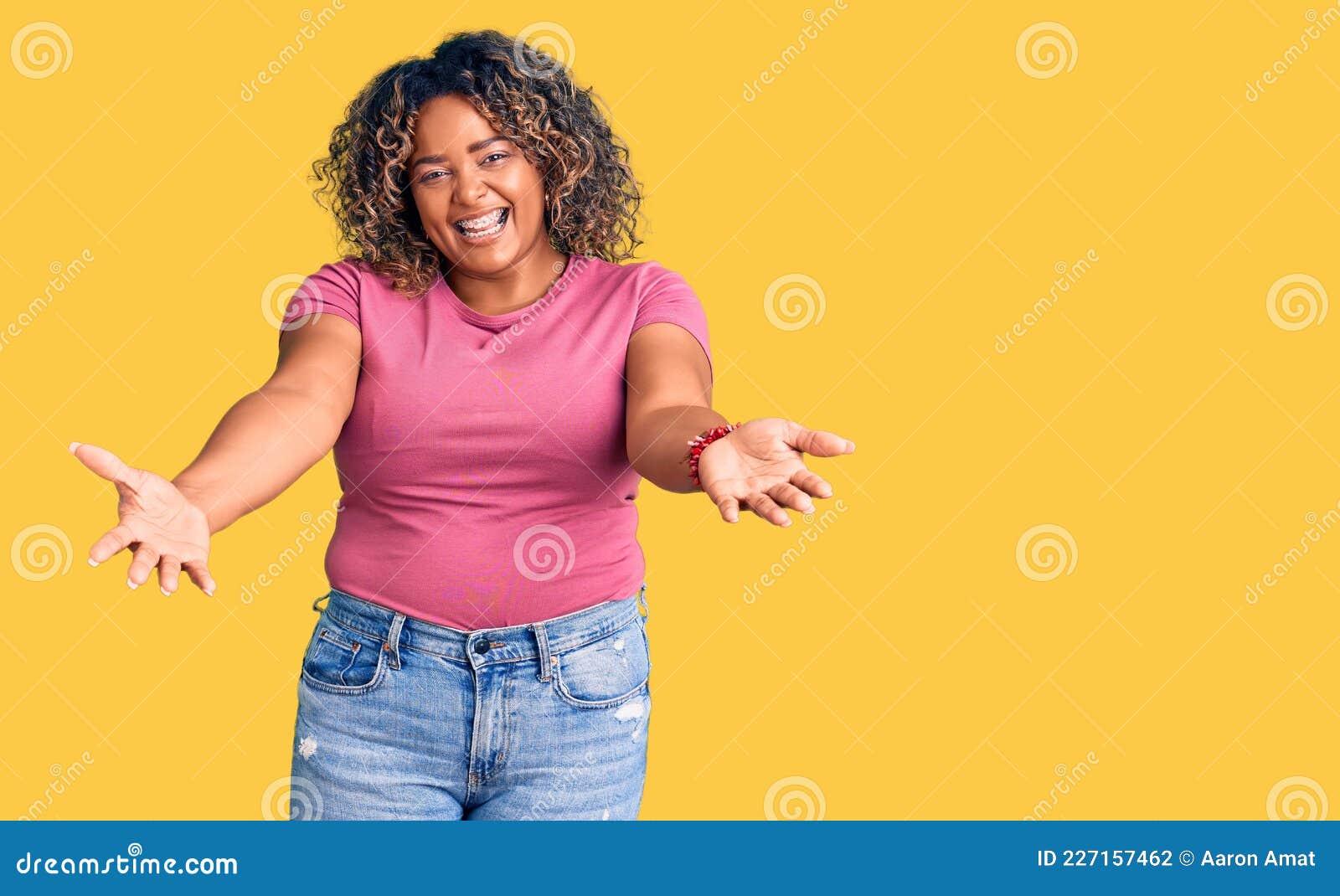 Young African American Plus Size Woman Wearing Casual Clothes Smiling