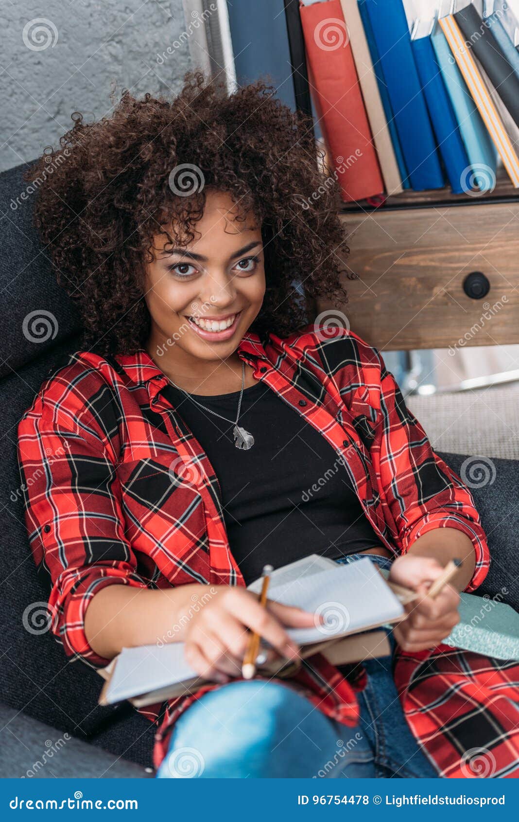 Young African American Student Studying with Books and Textbooks Stock ...