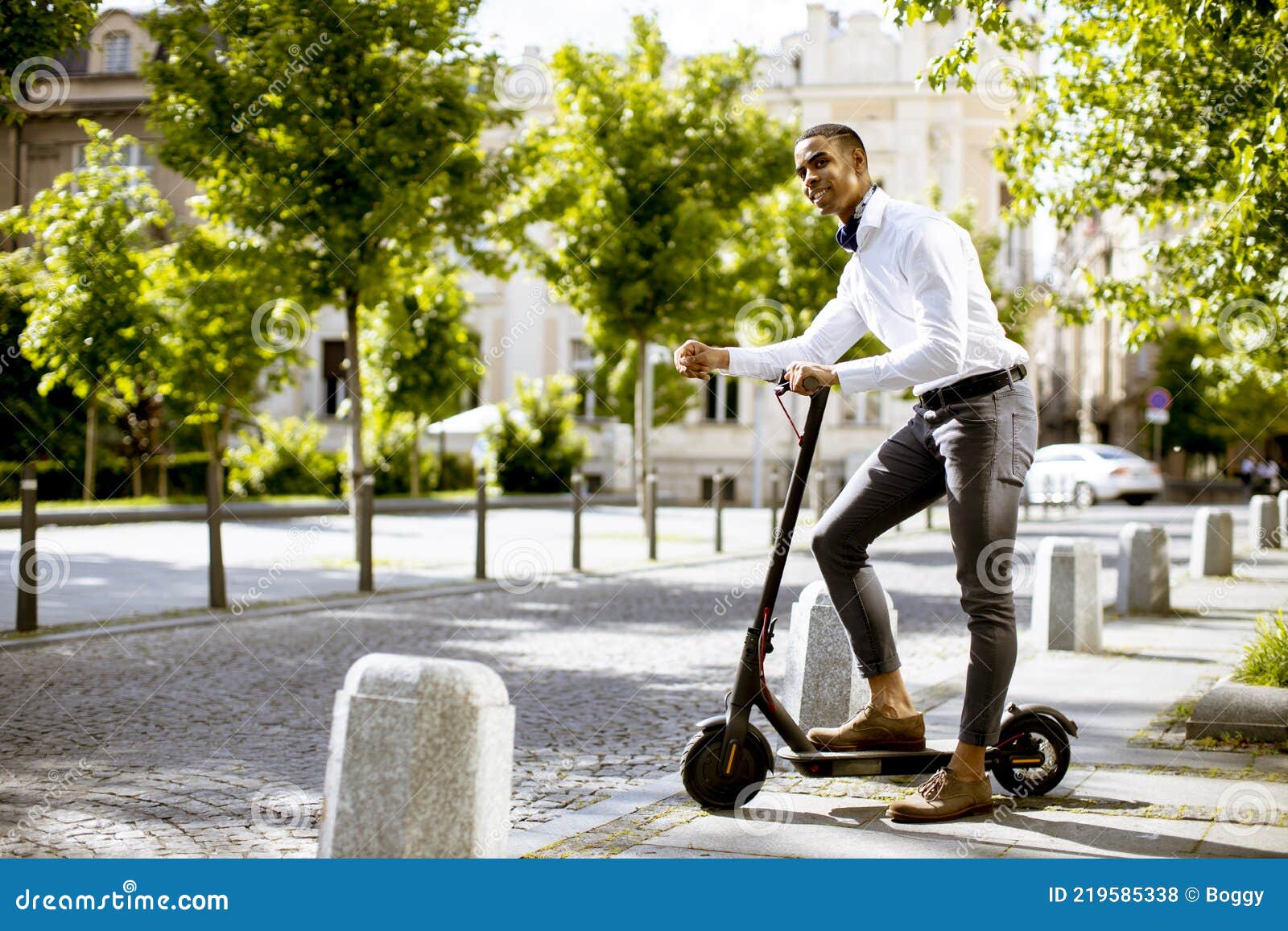 Young African American Using Electric Scooter on a Street Stock Photo ...