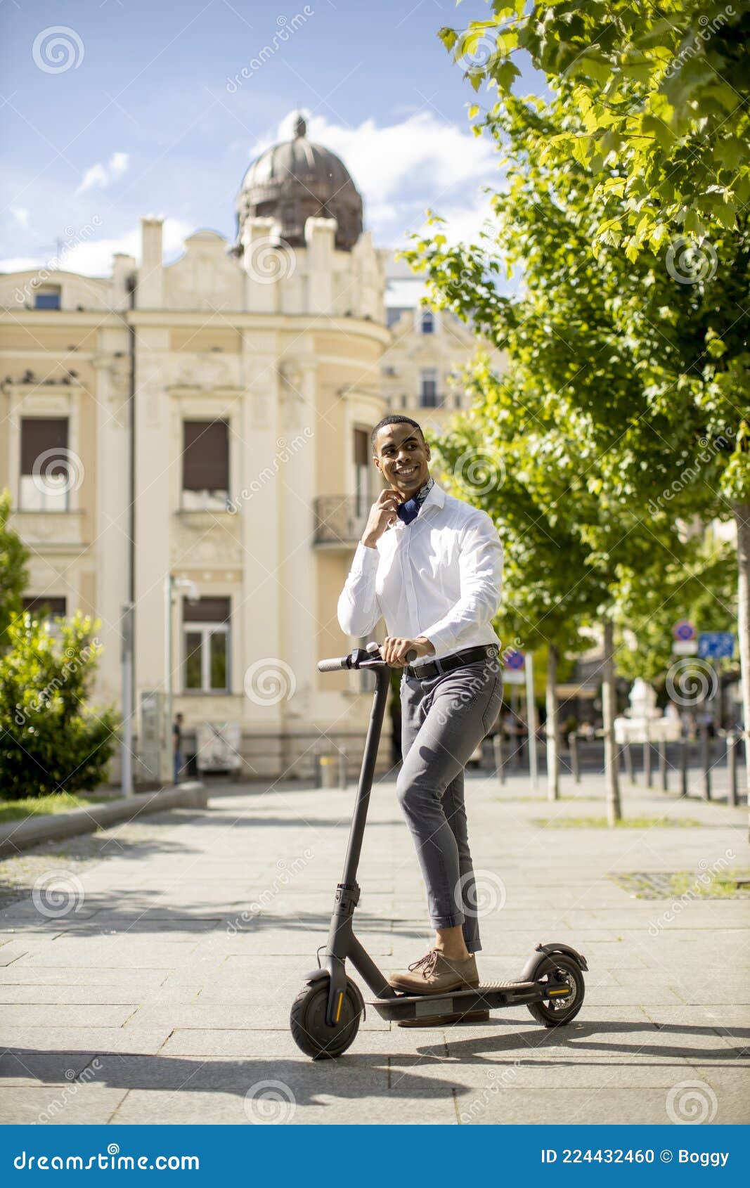 Young African American Using Electric Scooter on a Street Stock Photo ...