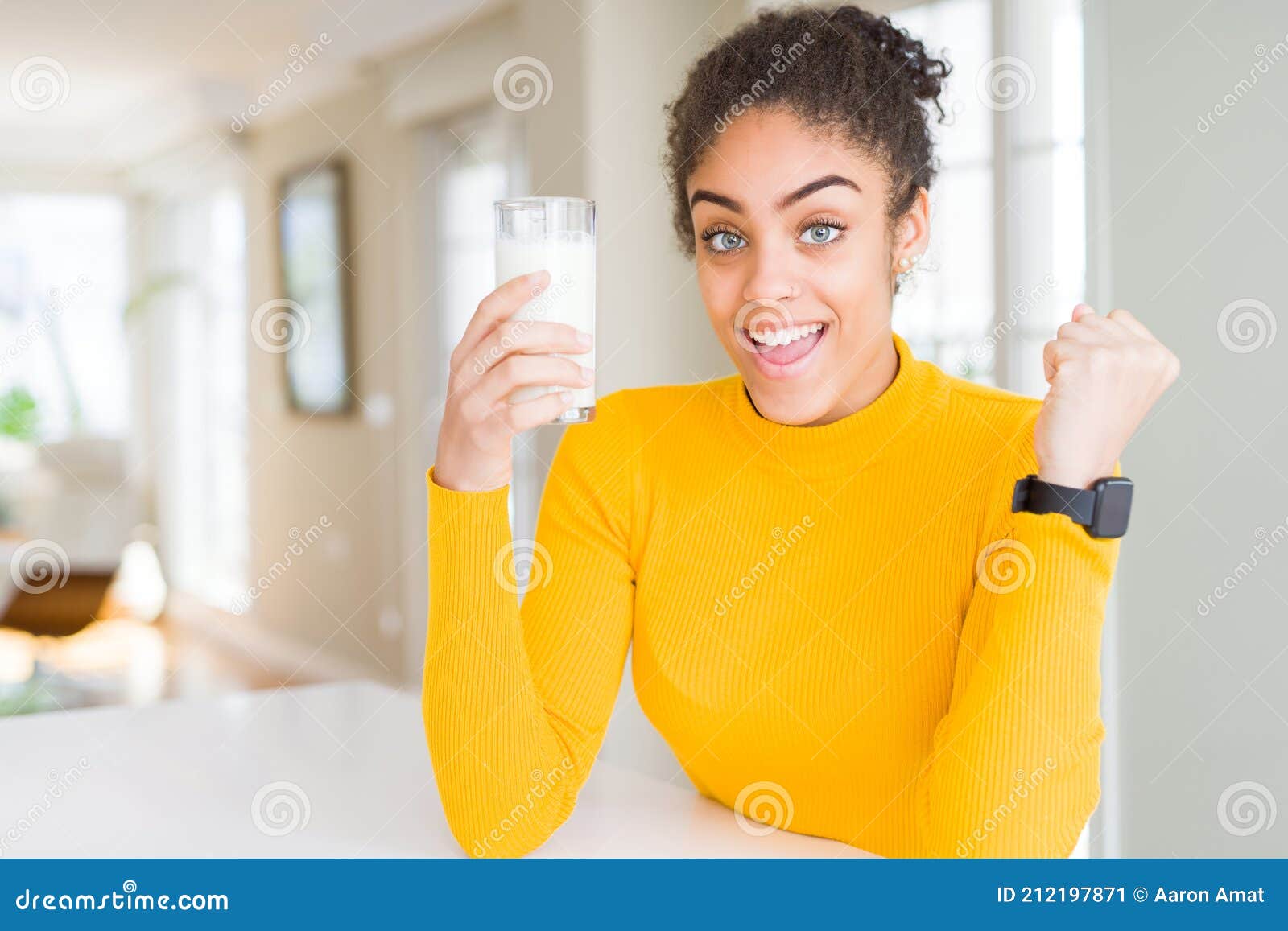 Young African American Woman Drinking A Glass Of Fresh Milk Screaming