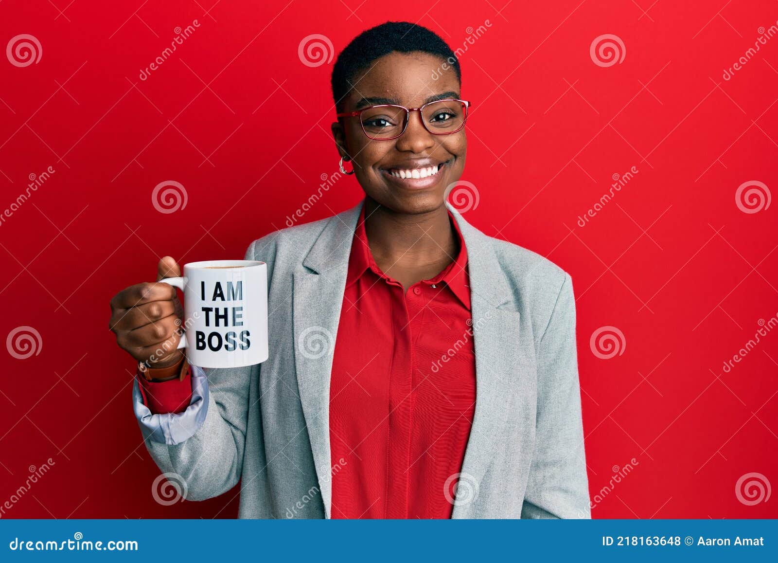 Young African American Woman Drinking From I Am The Boss Coffee Cup