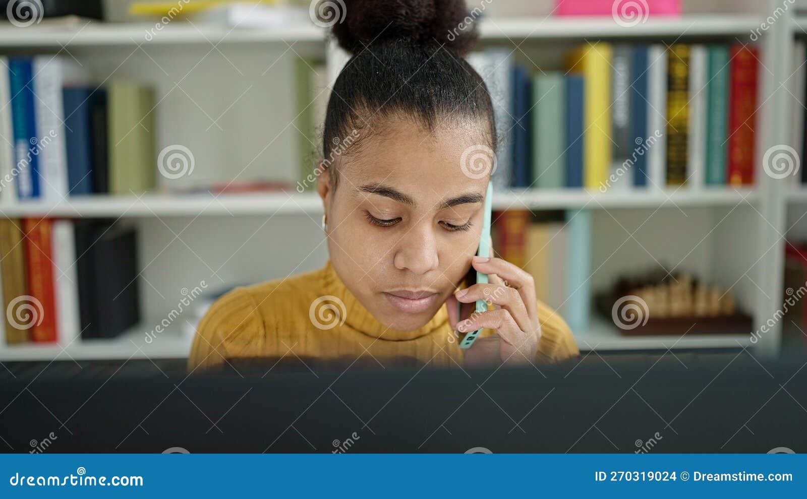 Young African American Woman Student Using Computer Speaking on the ...