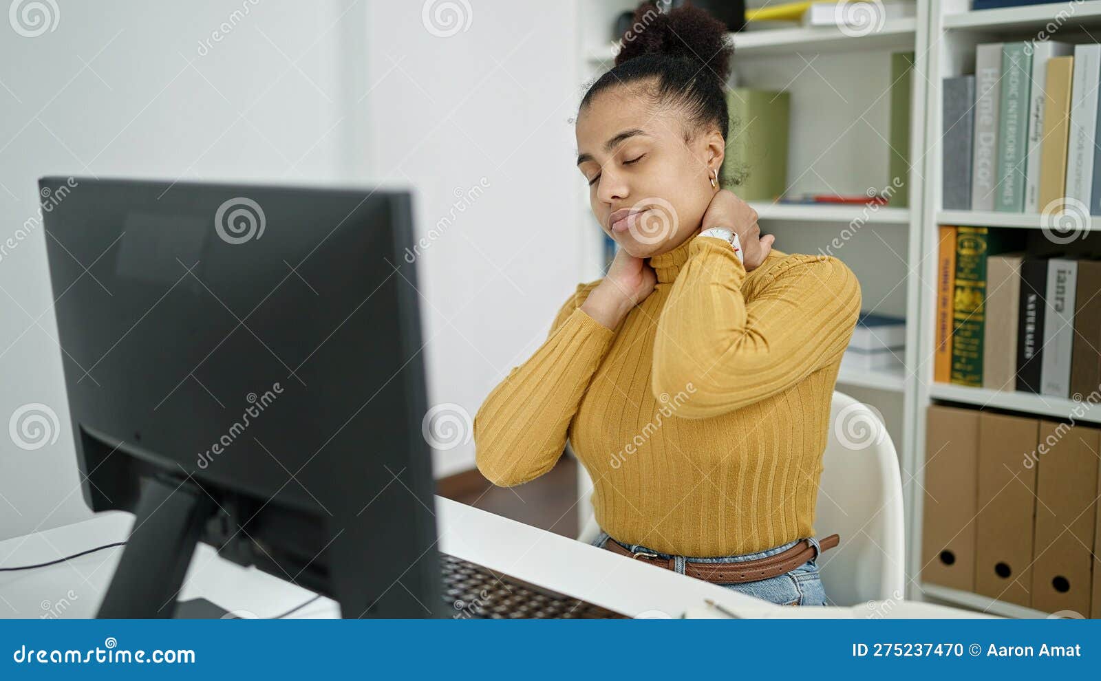 Young African American Woman Student Using Computer Stressed at the ...
