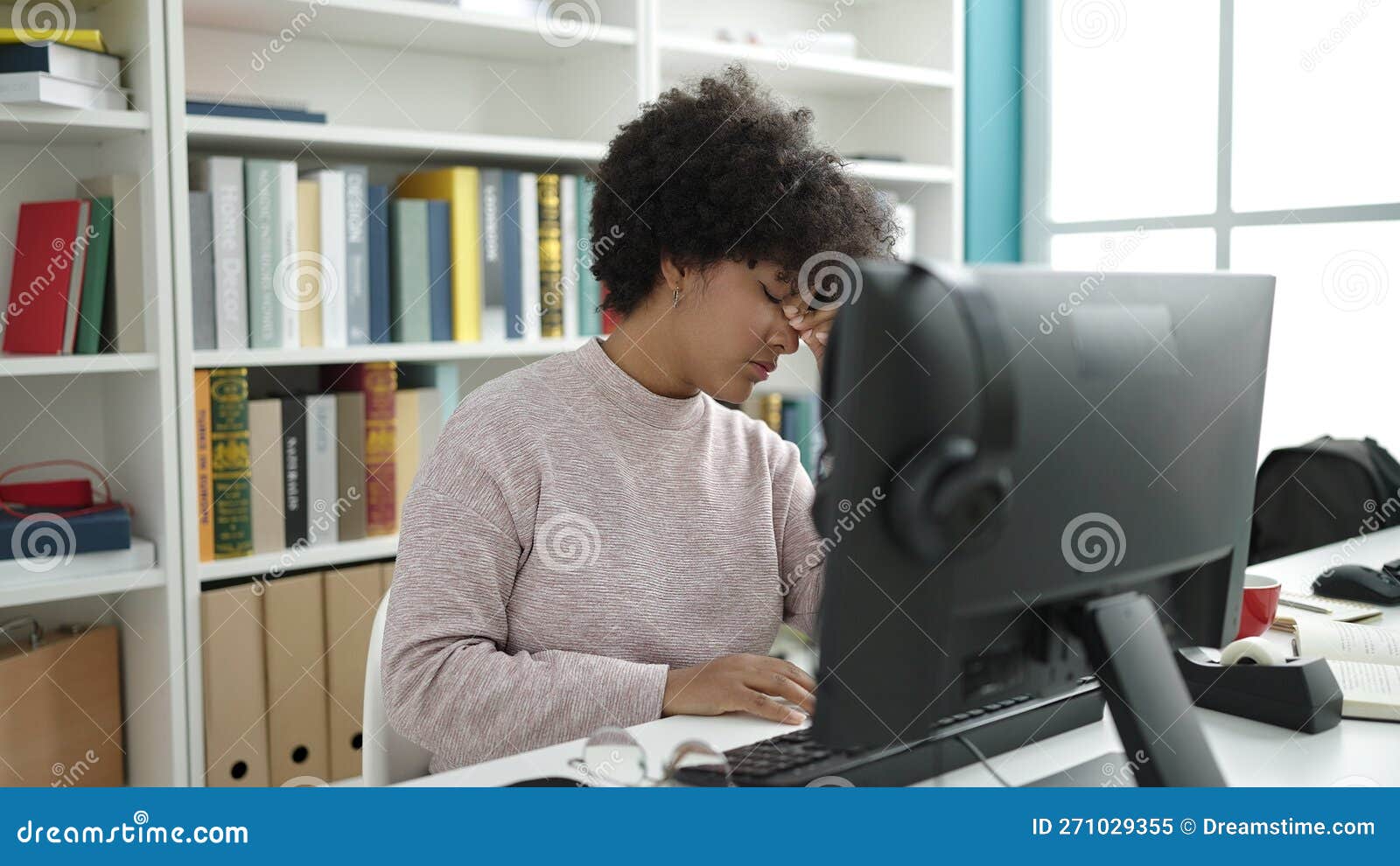 Young African American Woman Student Using Computer Stressed at ...