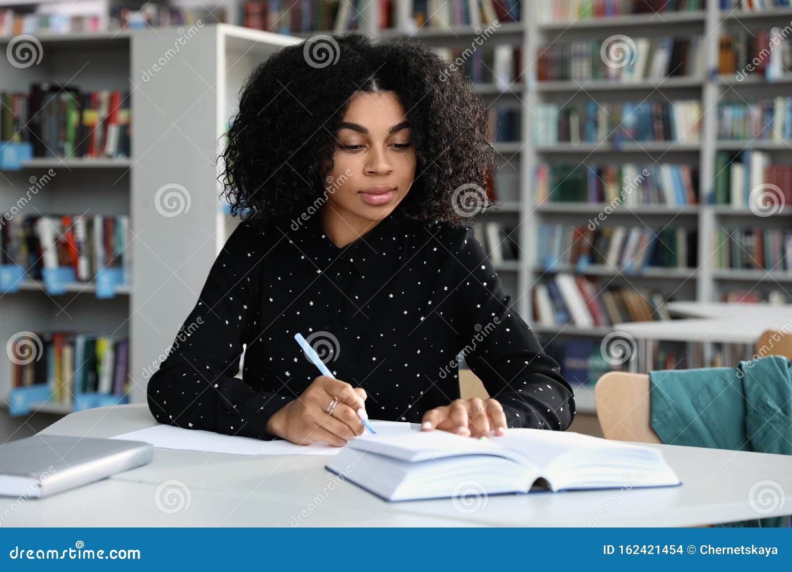Young African-American Woman Studying at Table Stock Photo - Image of ...