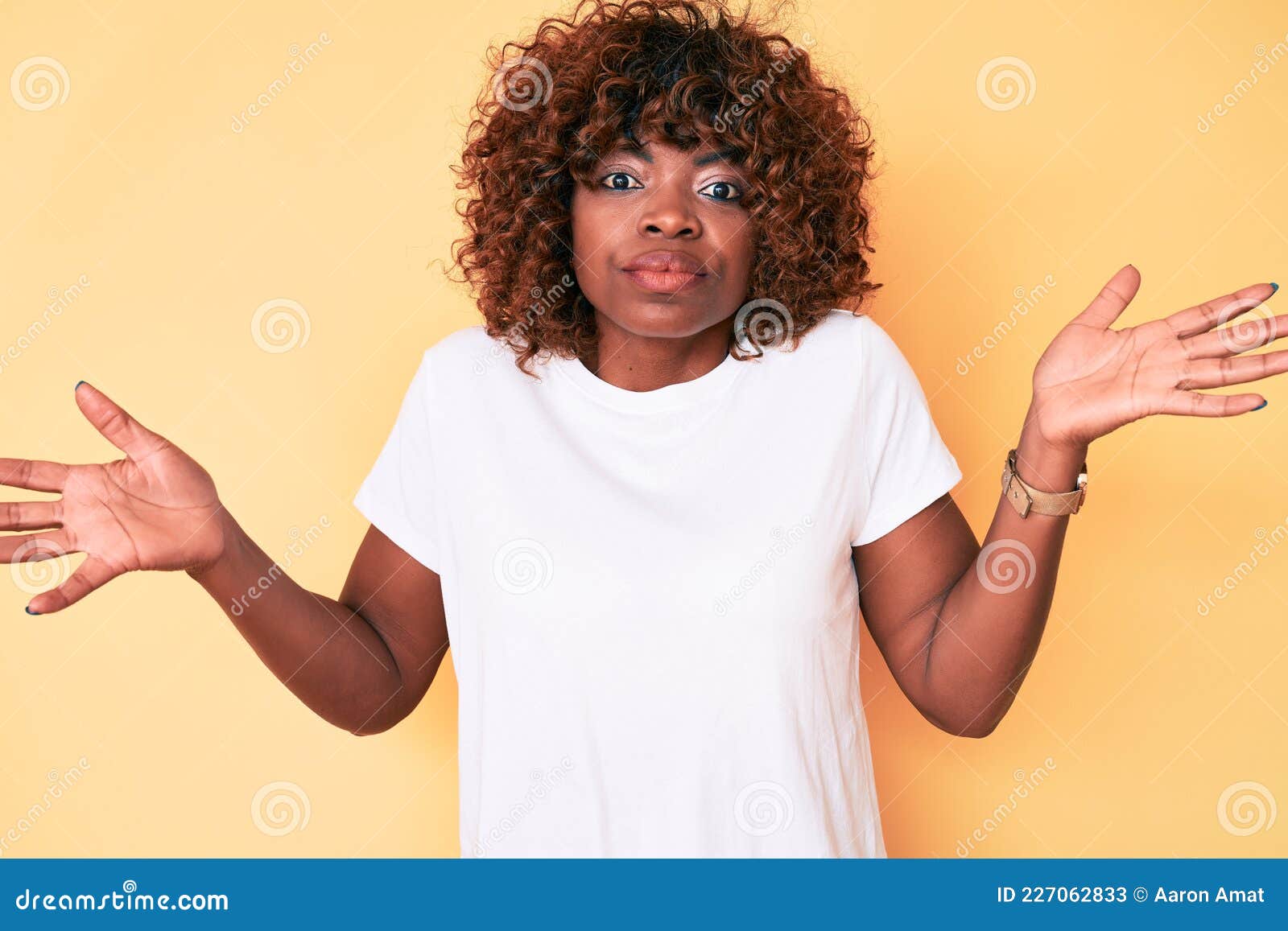 Young African American Woman Wearing Casual White T Shirt Clueless And