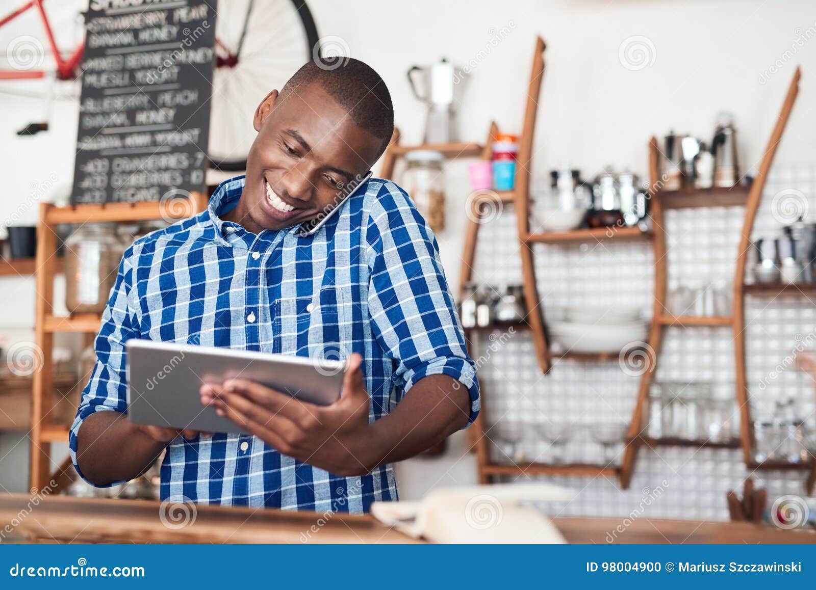 Young African Entrepreneur Hard at Work in His Cafe Stock Photo - Image ...
