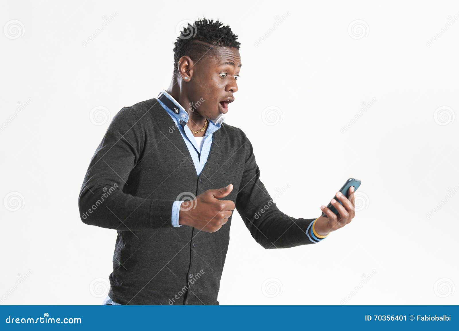 Young African Guy Looking at Cell Phone Stock Image - Image of phone ...
