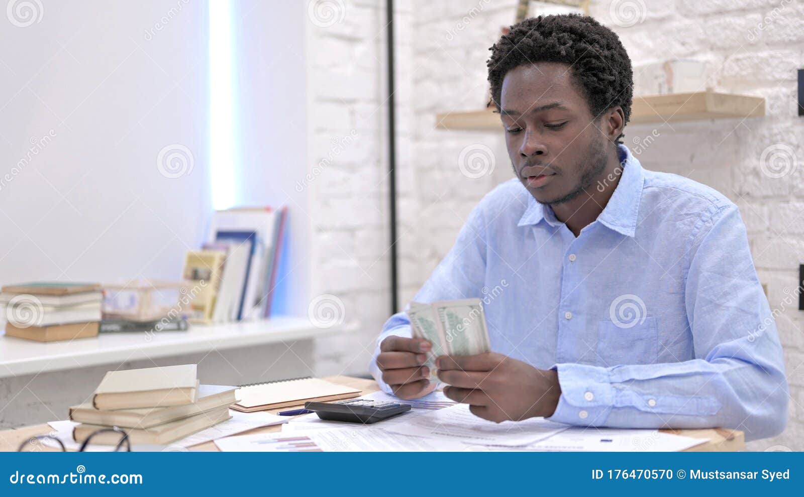 Young African Man Counting Money at Work Stock Photo - Image of ...