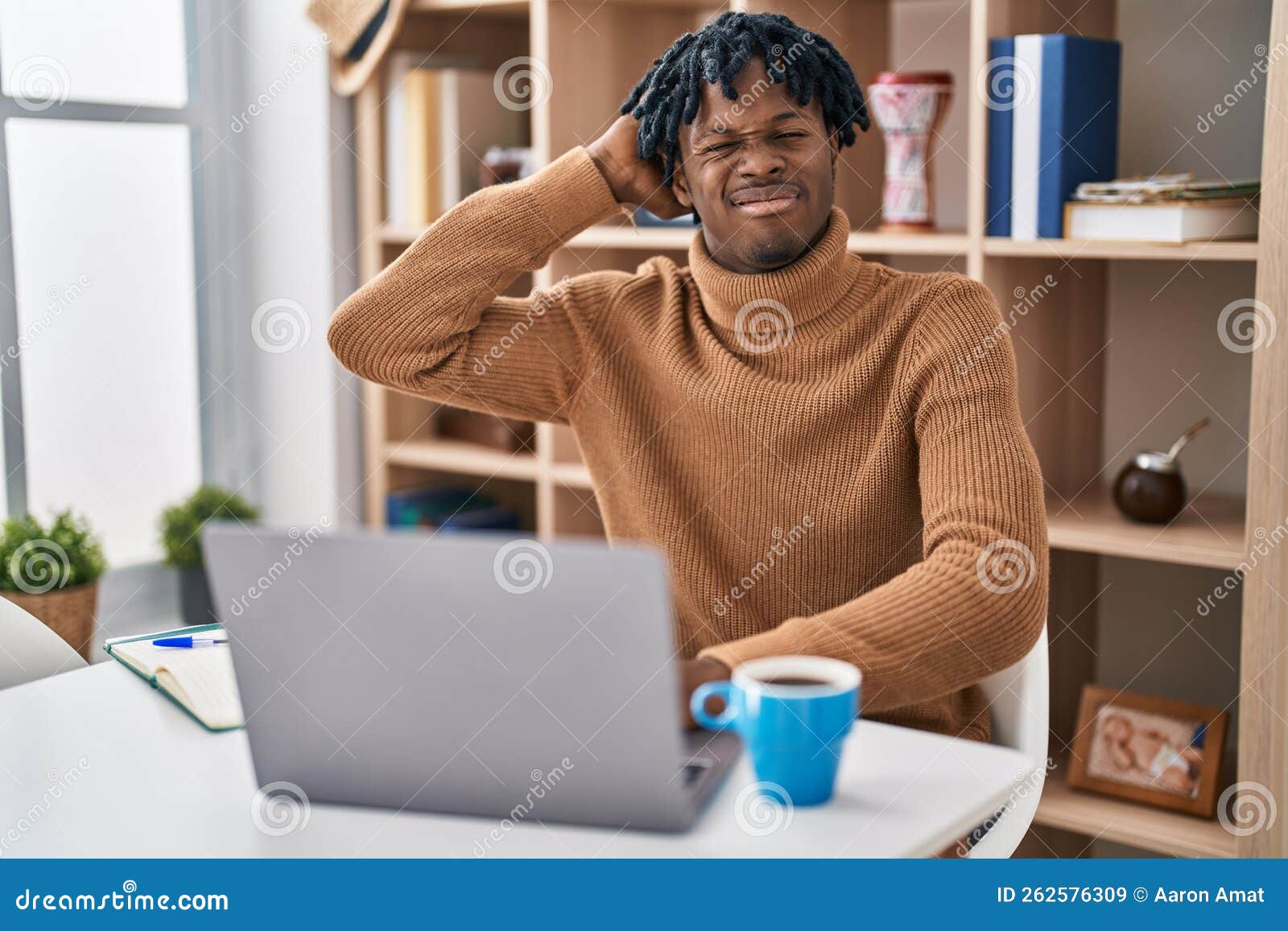 Young African Man with Dreadlocks Working Using Computer Laptop Confuse ...