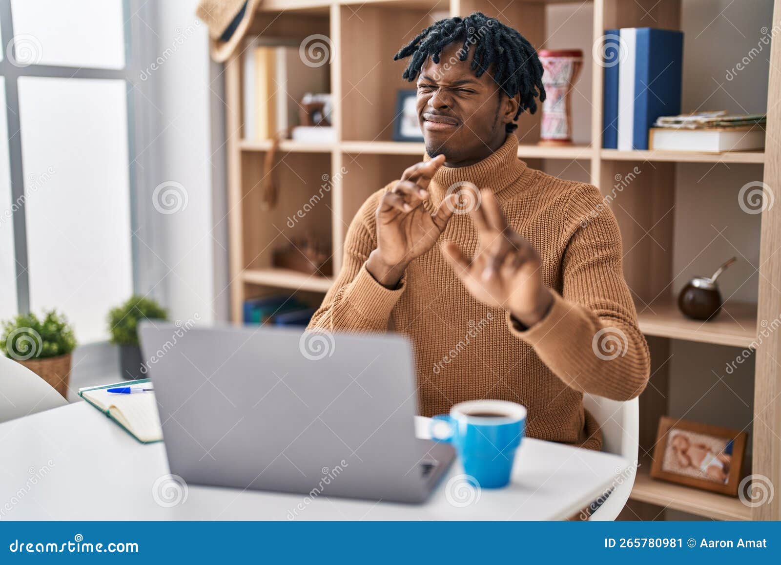 Young African Man with Dreadlocks Working Using Computer Laptop ...