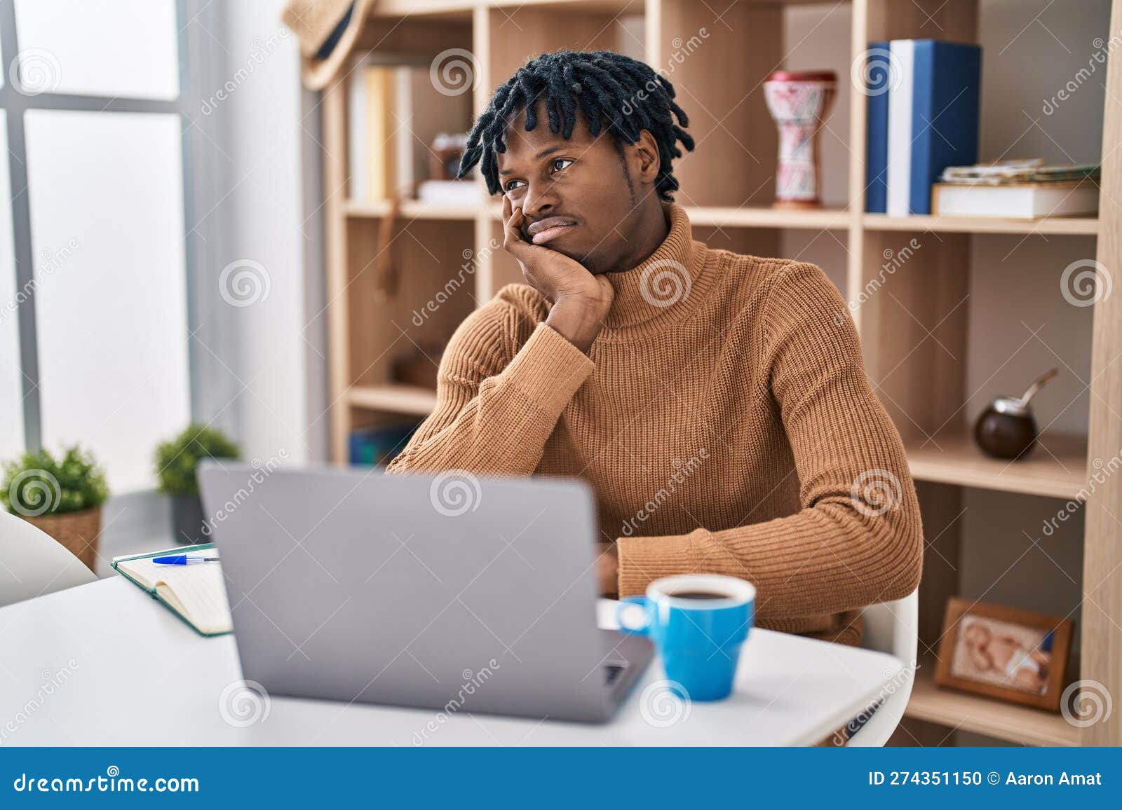 Young African Man with Dreadlocks Working Using Computer Laptop ...