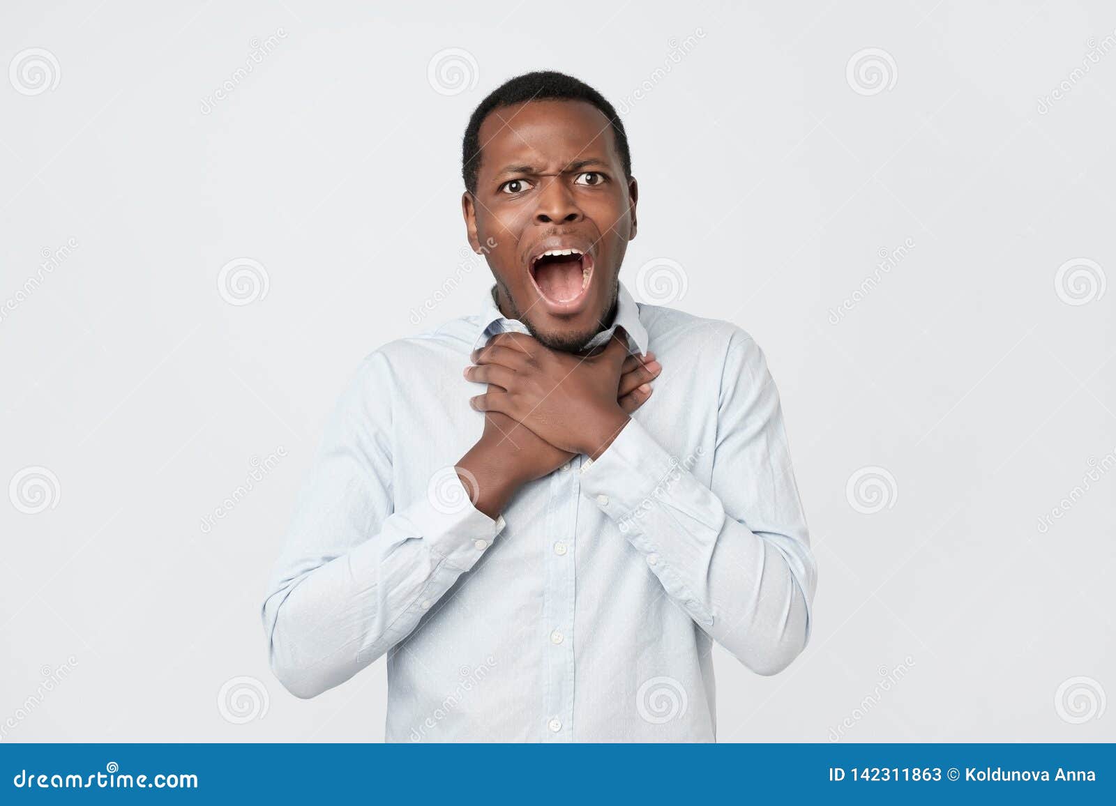 Young Man Choking With Male Instructor Standing Behind Performing ...