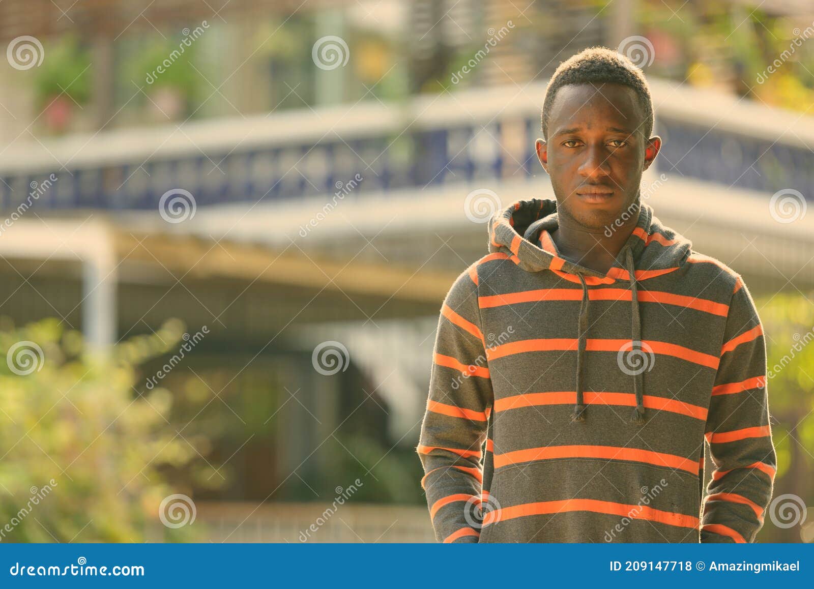 Young African man outdoors stock photo. Image of hoodie - 209147718