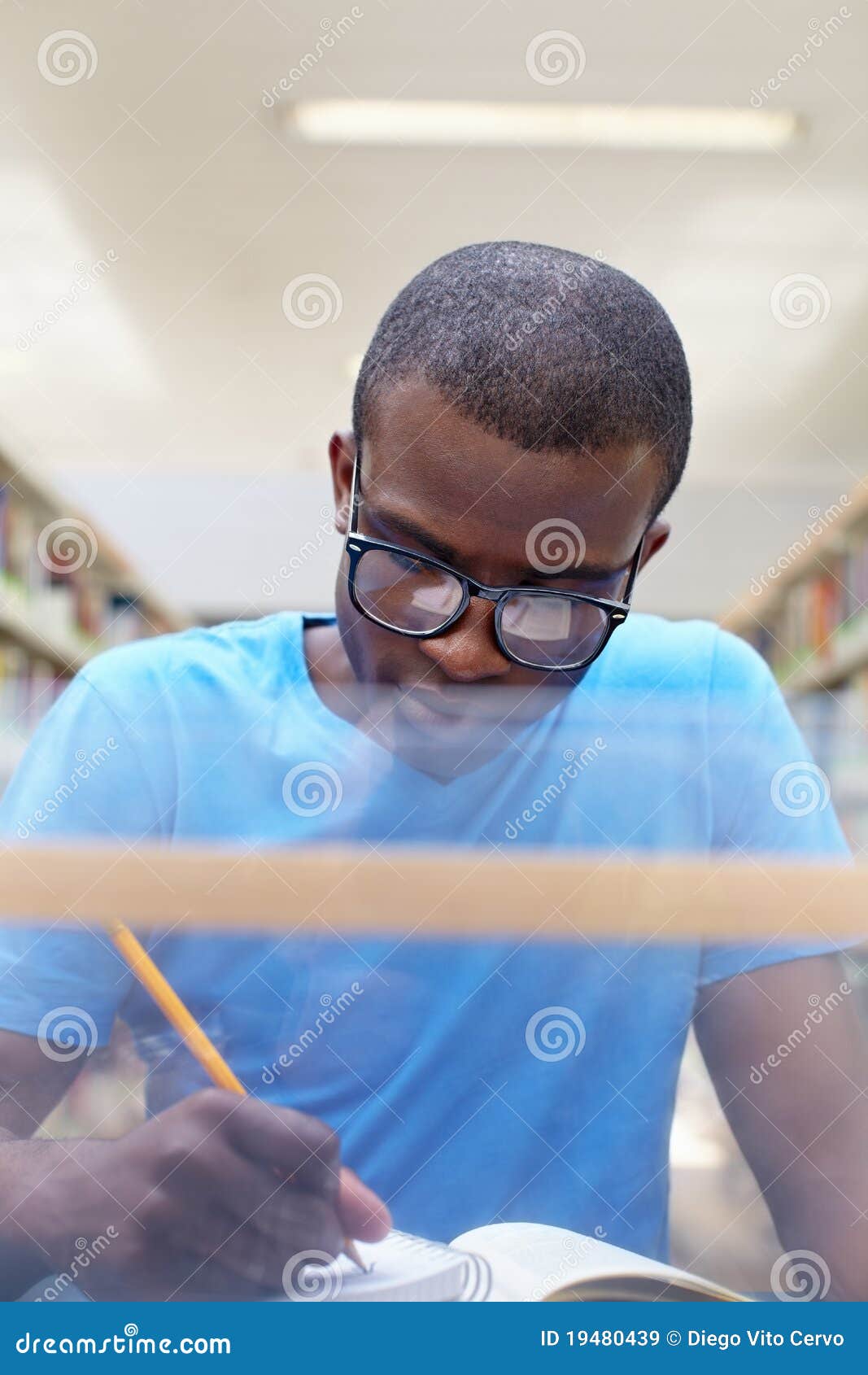 Young African Man Studying in Library Stock Image - Image of ...