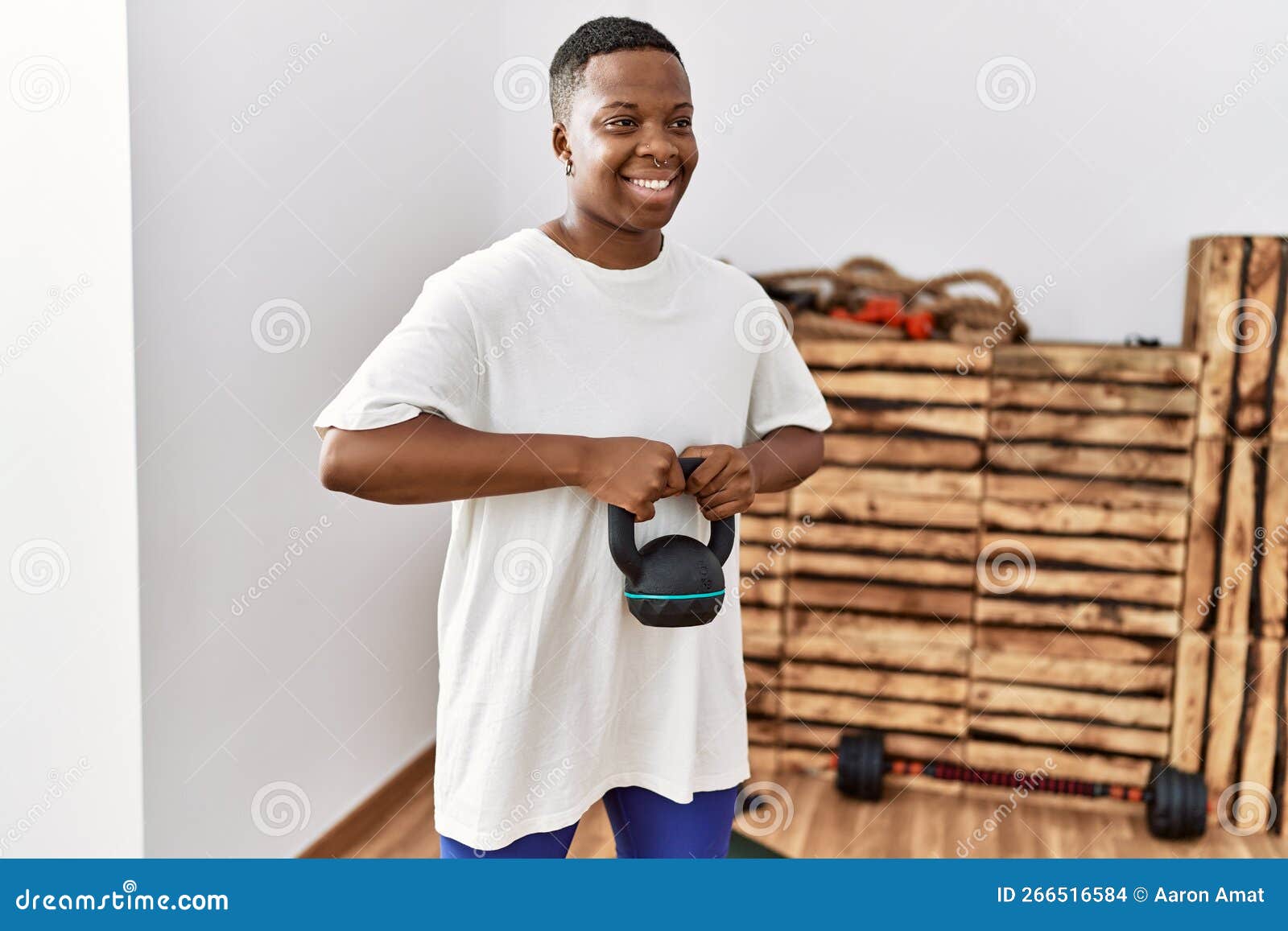 Young African Man Training with Dumbbells at the Gym Stock Photo ...