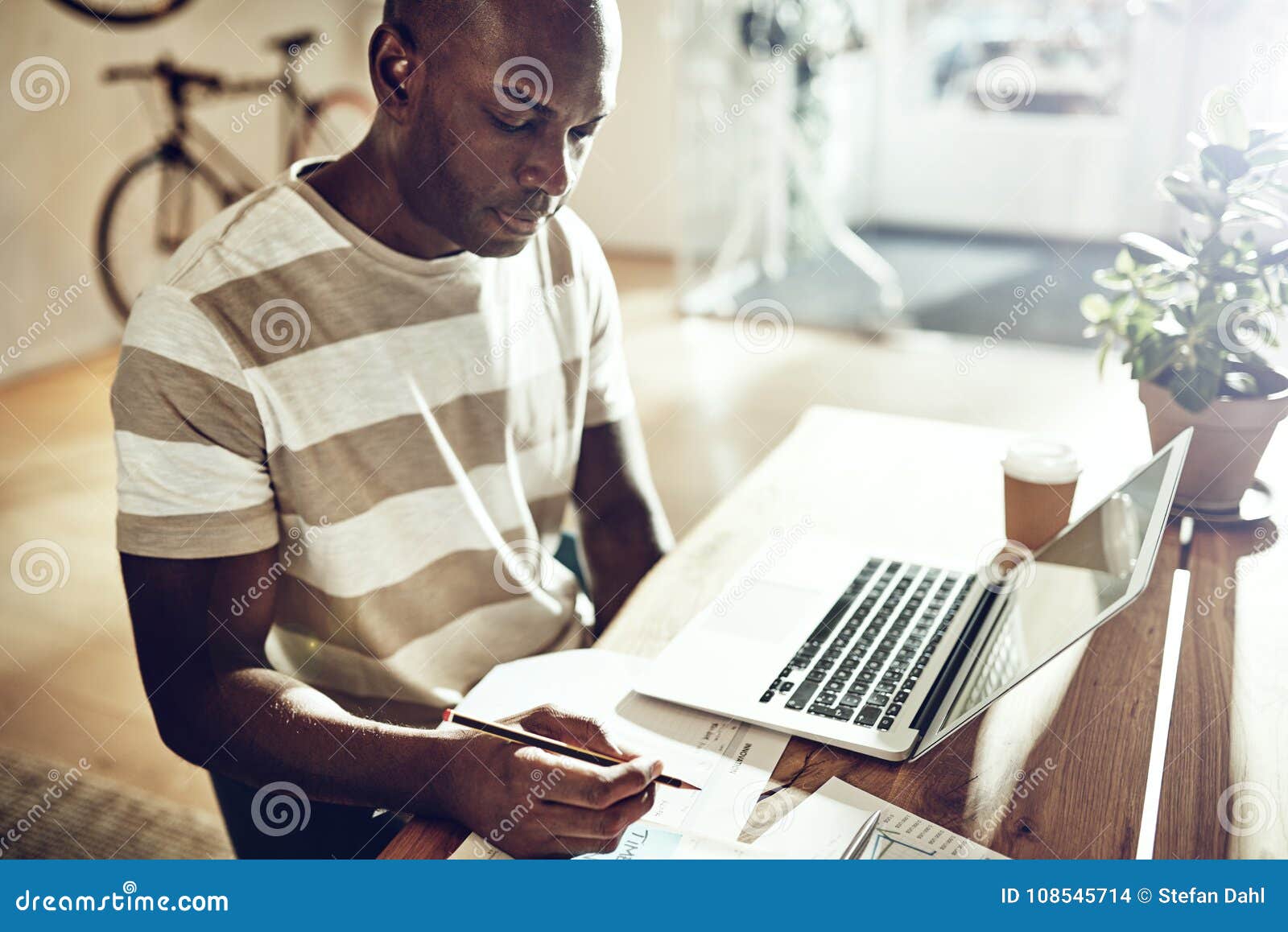 Young African Man Working at a Desk in an Office Stock Photo - Image of ...