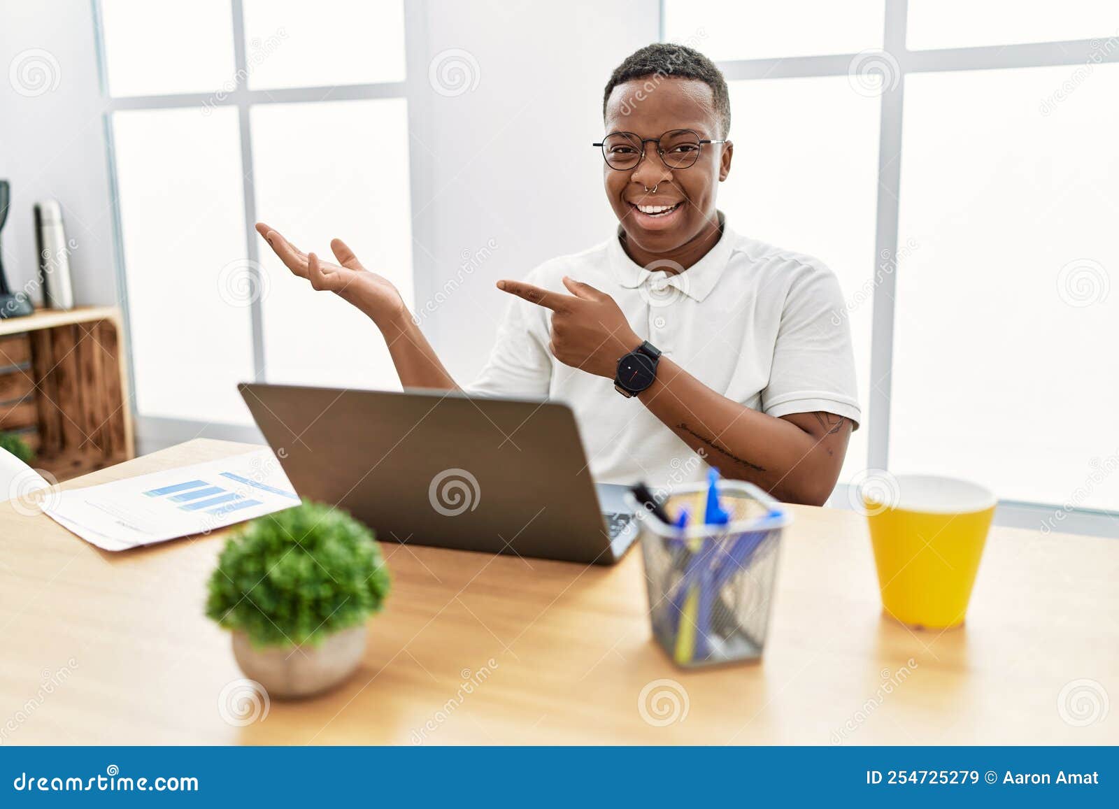 Young African Man Working at the Office Using Computer Laptop Amazed ...