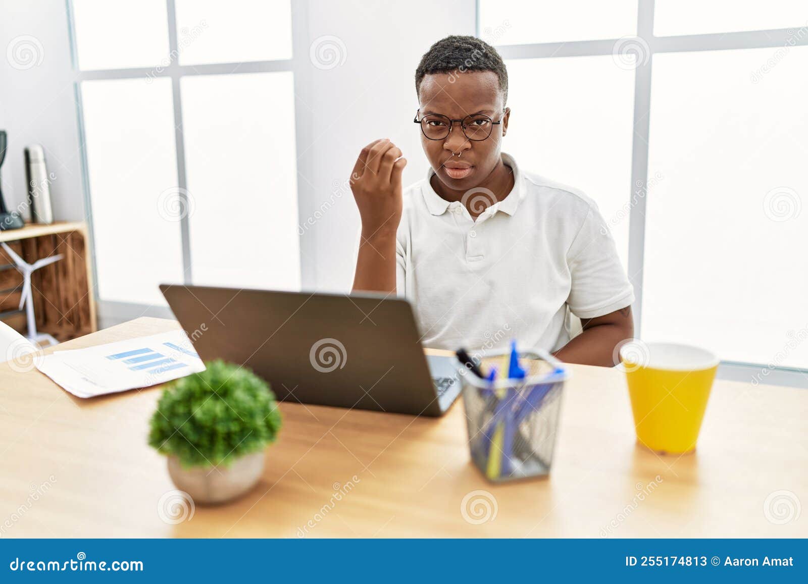 Young African Man Working at the Office Using Computer Laptop Doing ...
