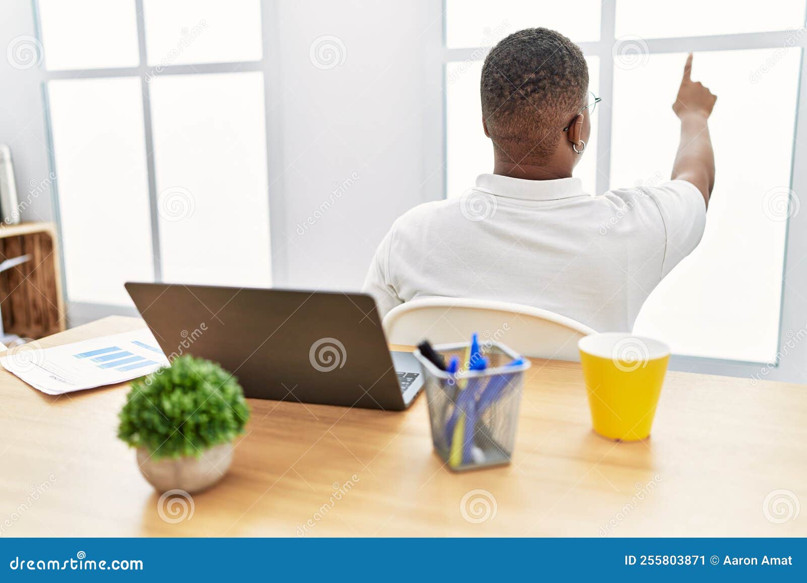 Young African Man Working at the Office Using Computer Laptop Posing ...