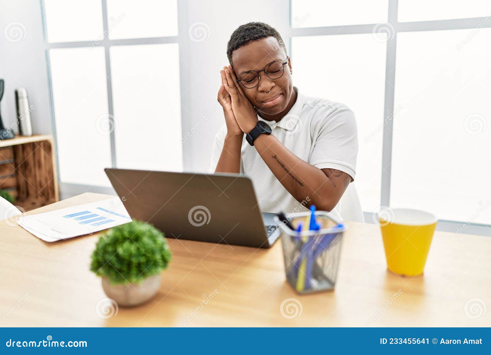 Young African Man Working at the Office Using Computer Laptop Sleeping ...