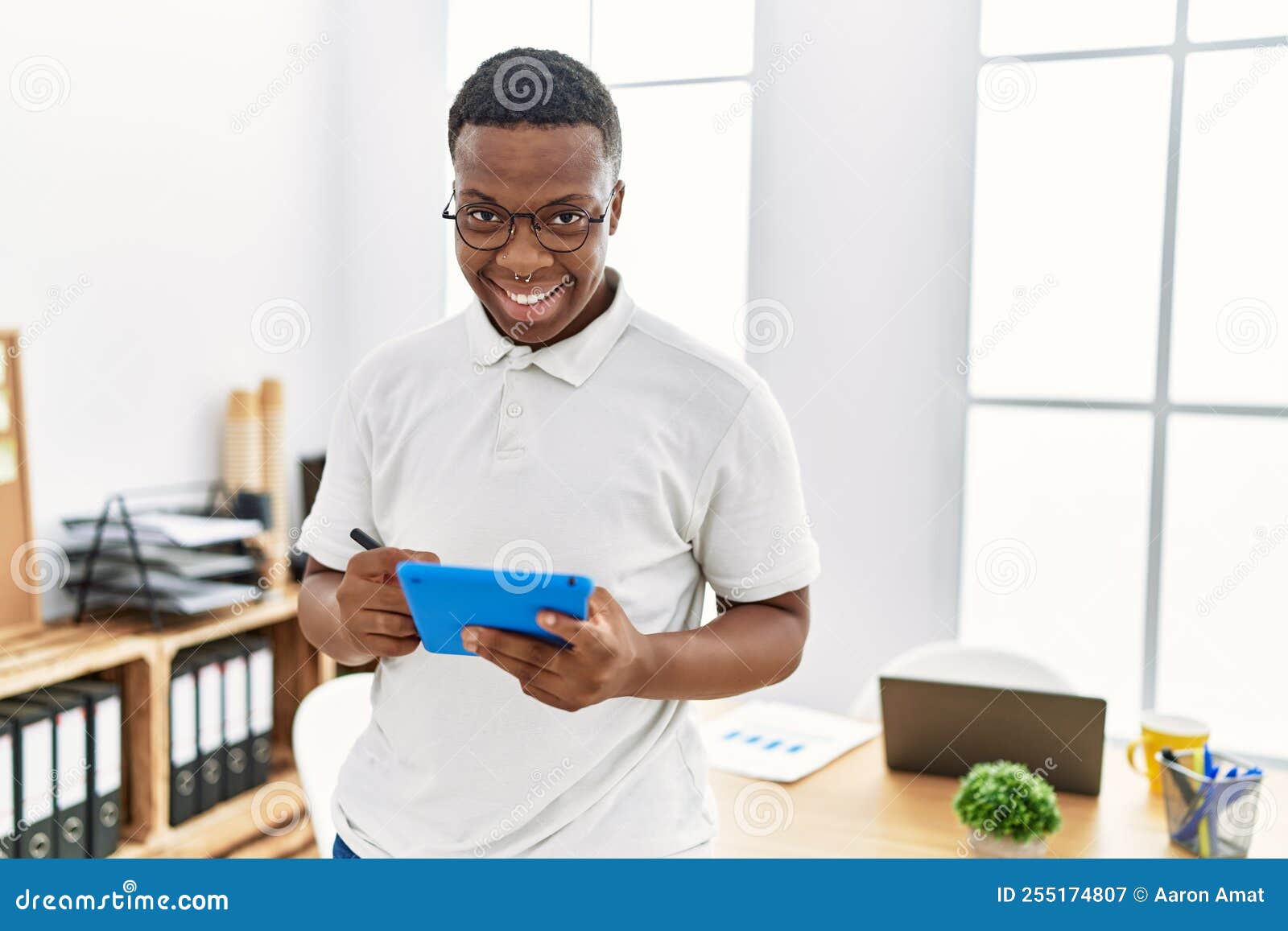 Young African Man Working Using Touchpad Device at Business Office ...