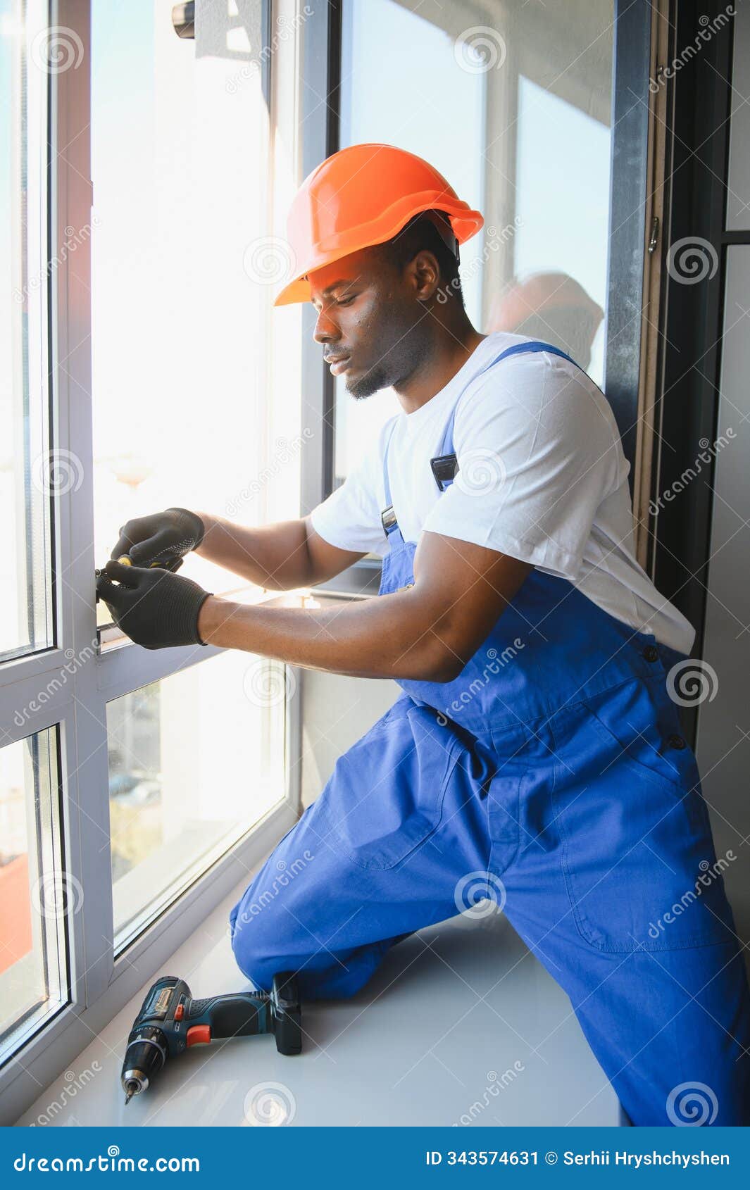Young African Repairman in Overalls Installing Window Stock Image ...