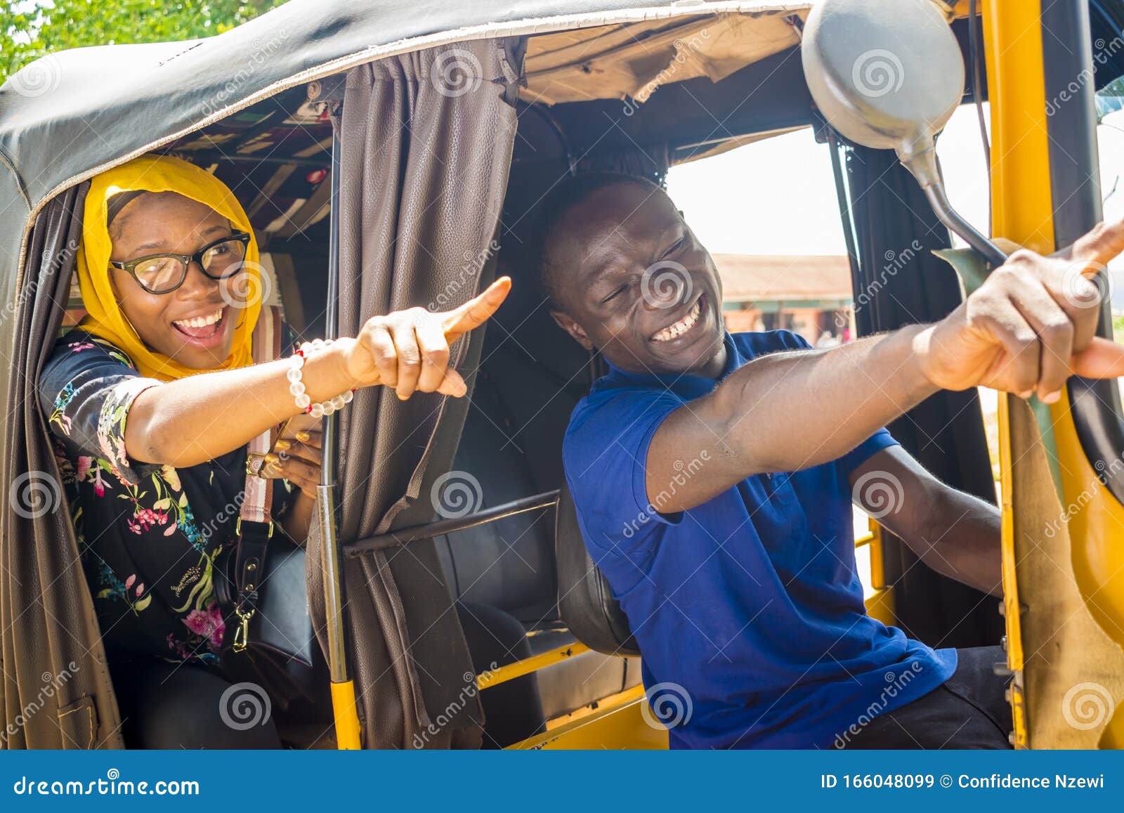 Young African Woman Giving Directions To the Driver of an Auto Rickshaw ... Young African Woman Giving Directions To the Driver of an Auto Rickshaw ...
