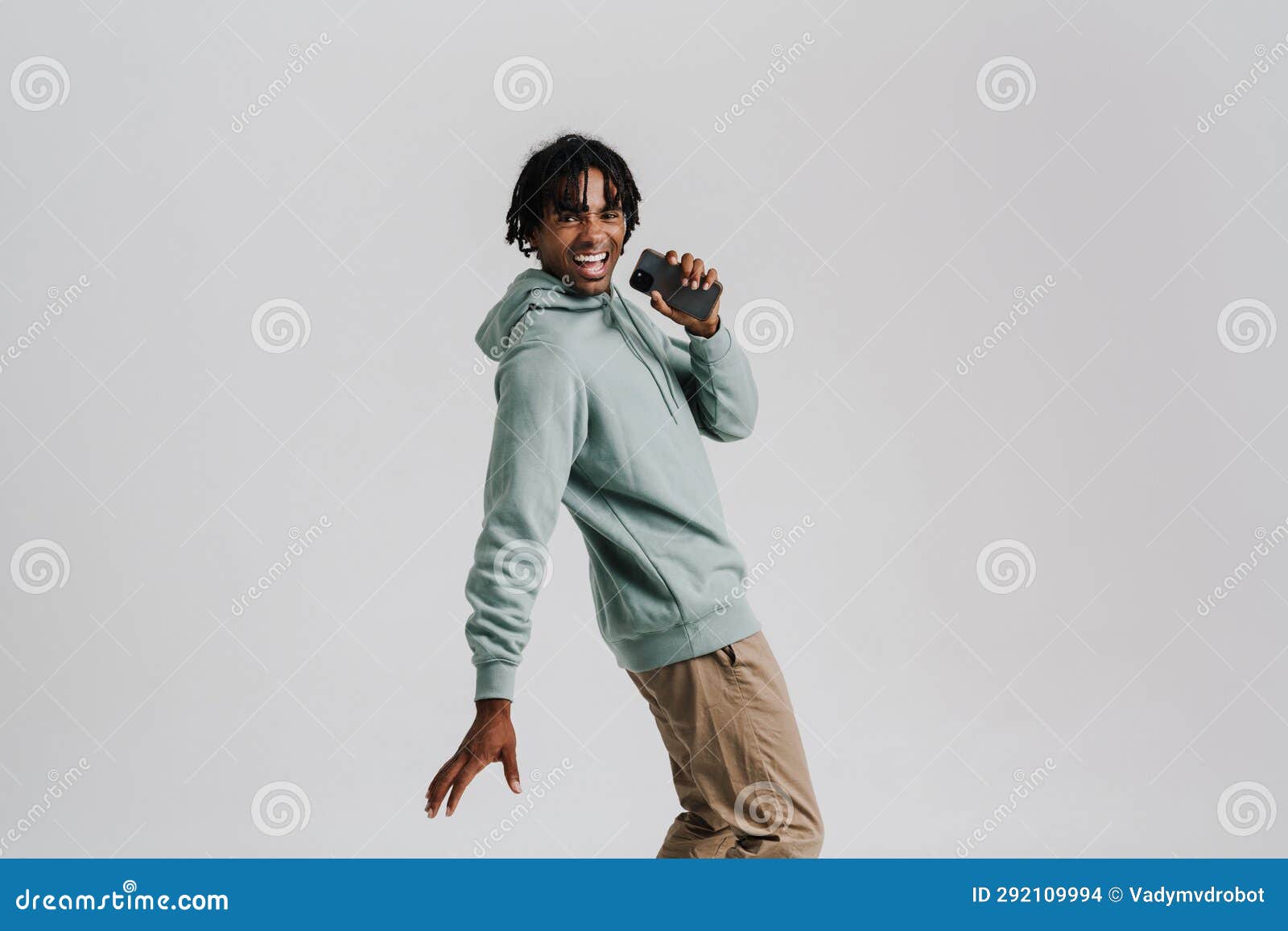 Young Afro Man Singing while Holding Phone As Microphone Isolated Stock ...
