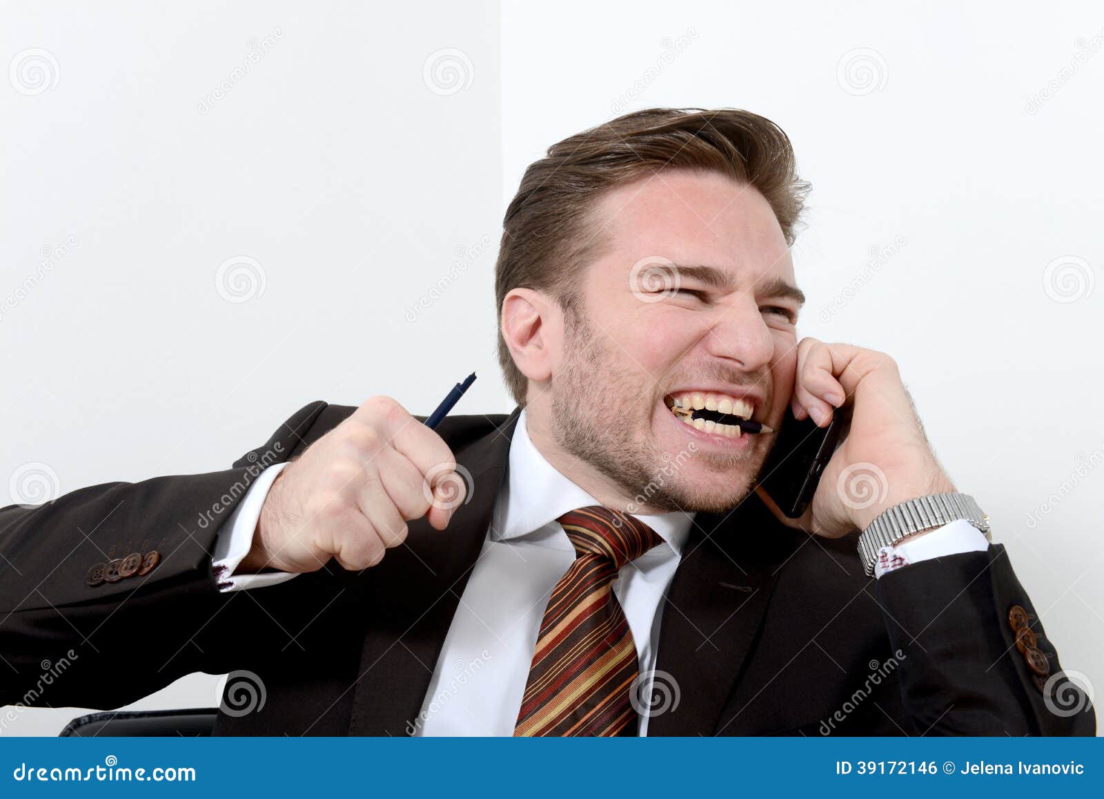 Young Angry Businessman Breaking a Pencil with Teeth Stock Photo ...