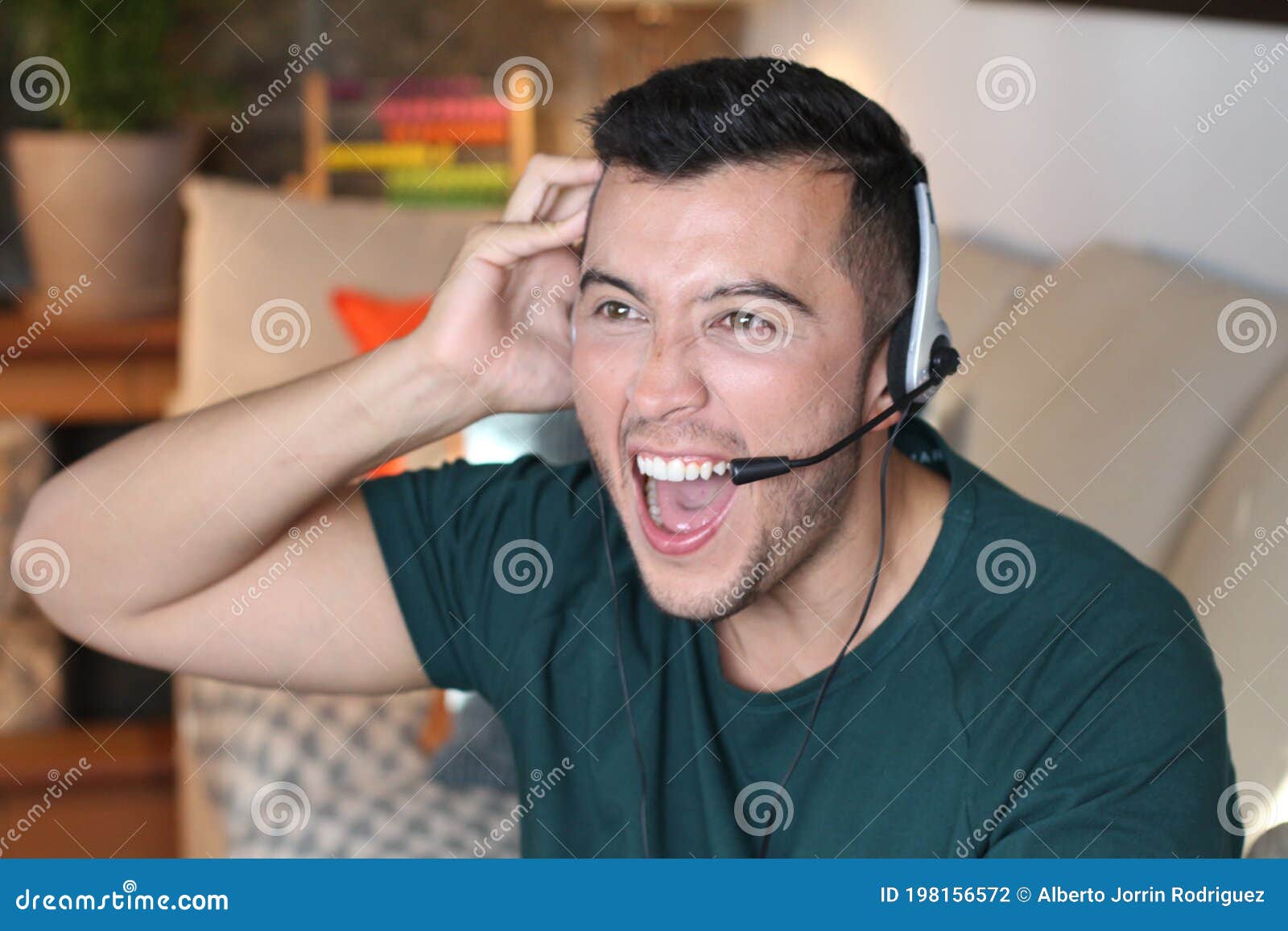 Young Angry Man Using Headset at Home Stock Photo - Image of latino ...