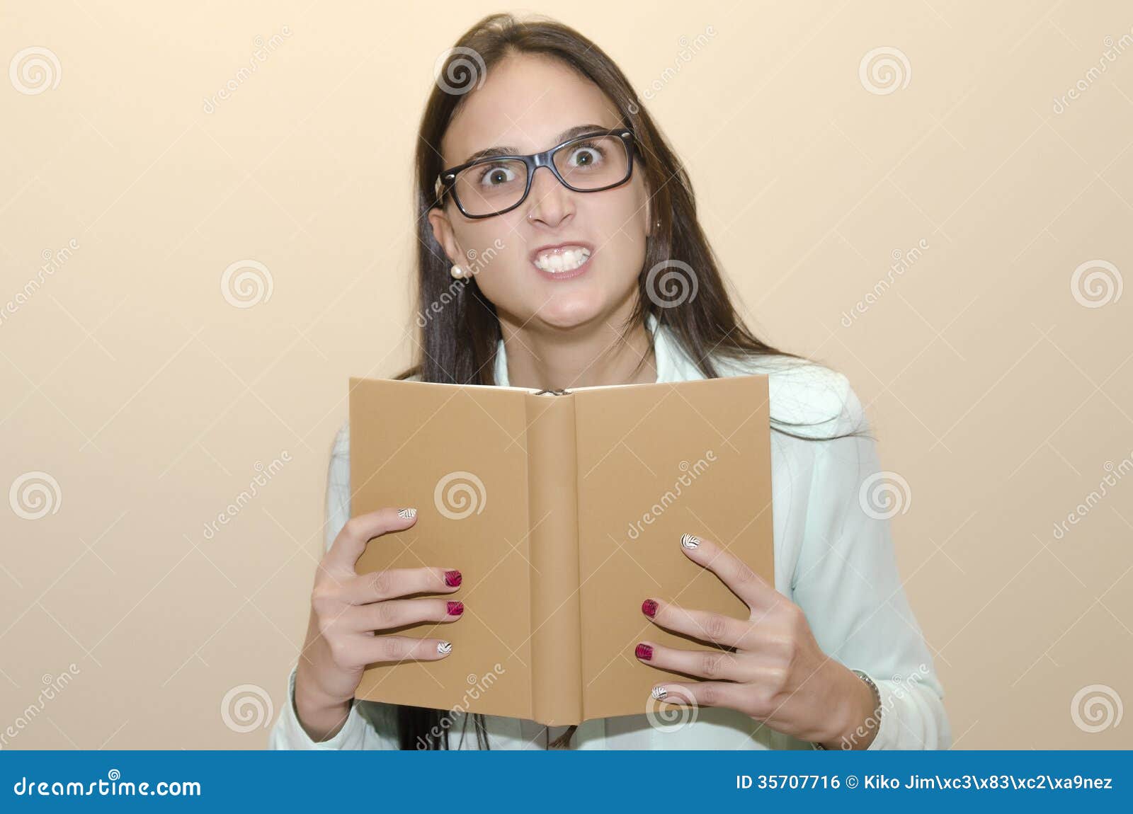 Young Angry Woman with Book Stock Photo - Image of intelligent ...
